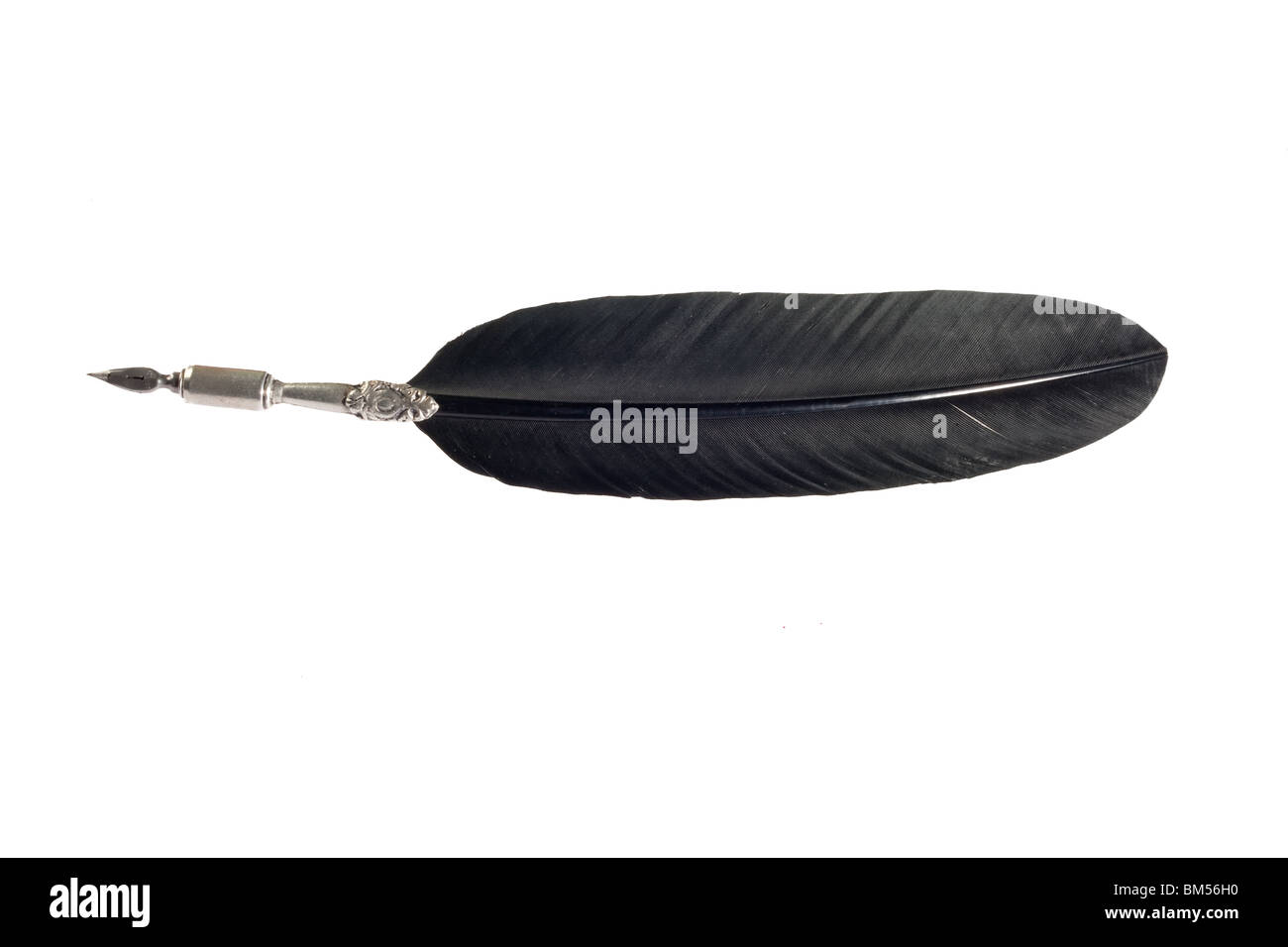 Quill pen made out of silver metal and black feather isolated on white ...