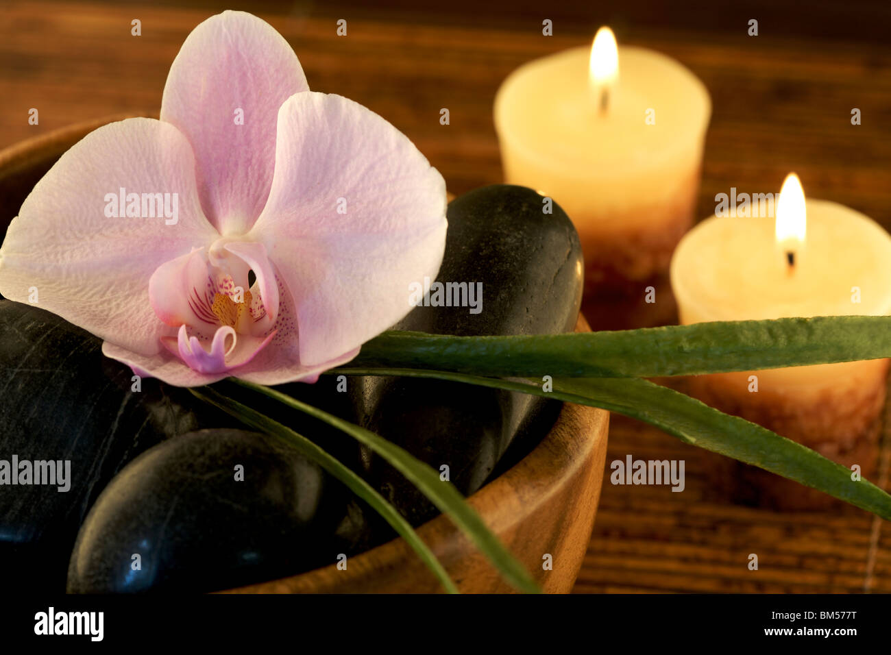 Zen-like scene with flower and candles Stock Photo - Alamy
