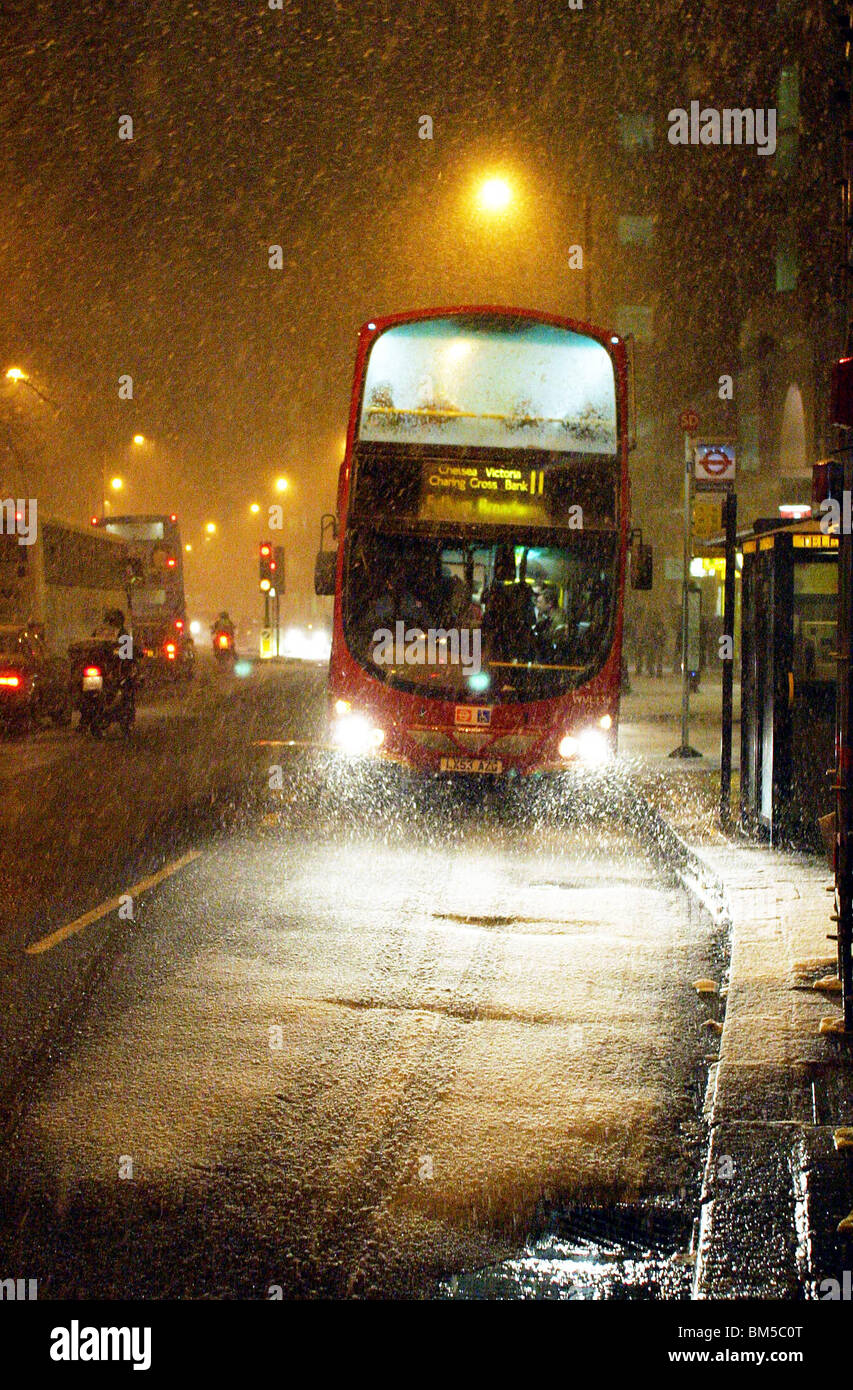 London Bus in heavy snow on Victoria Street in London Stock Photo - Alamy