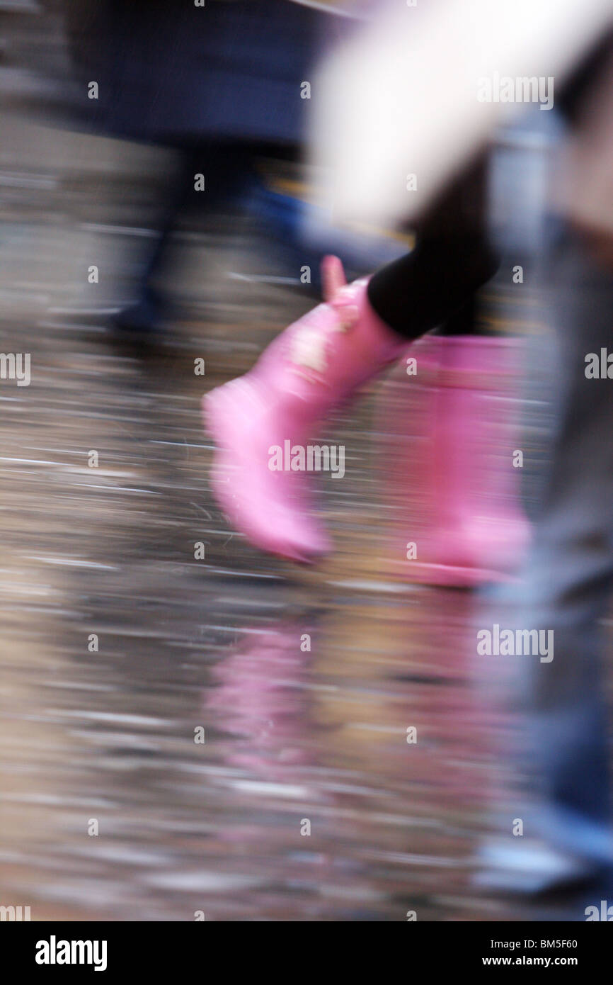 Legs detail of Person walking in street in rainy day. Rome Italy Europe ...
