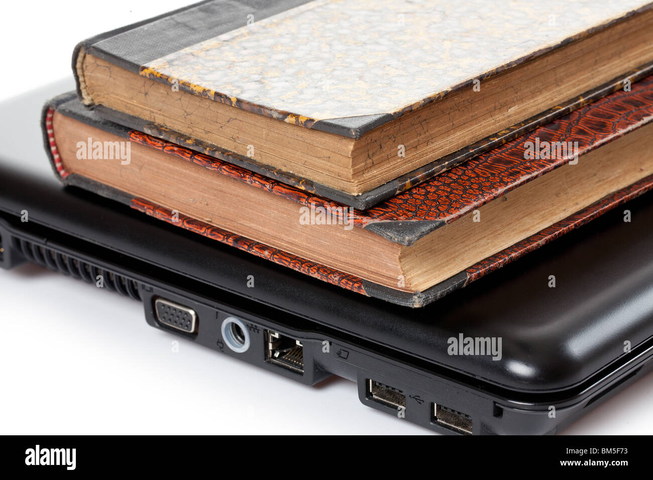 old books and laptop on white background Stock Photo - Alamy