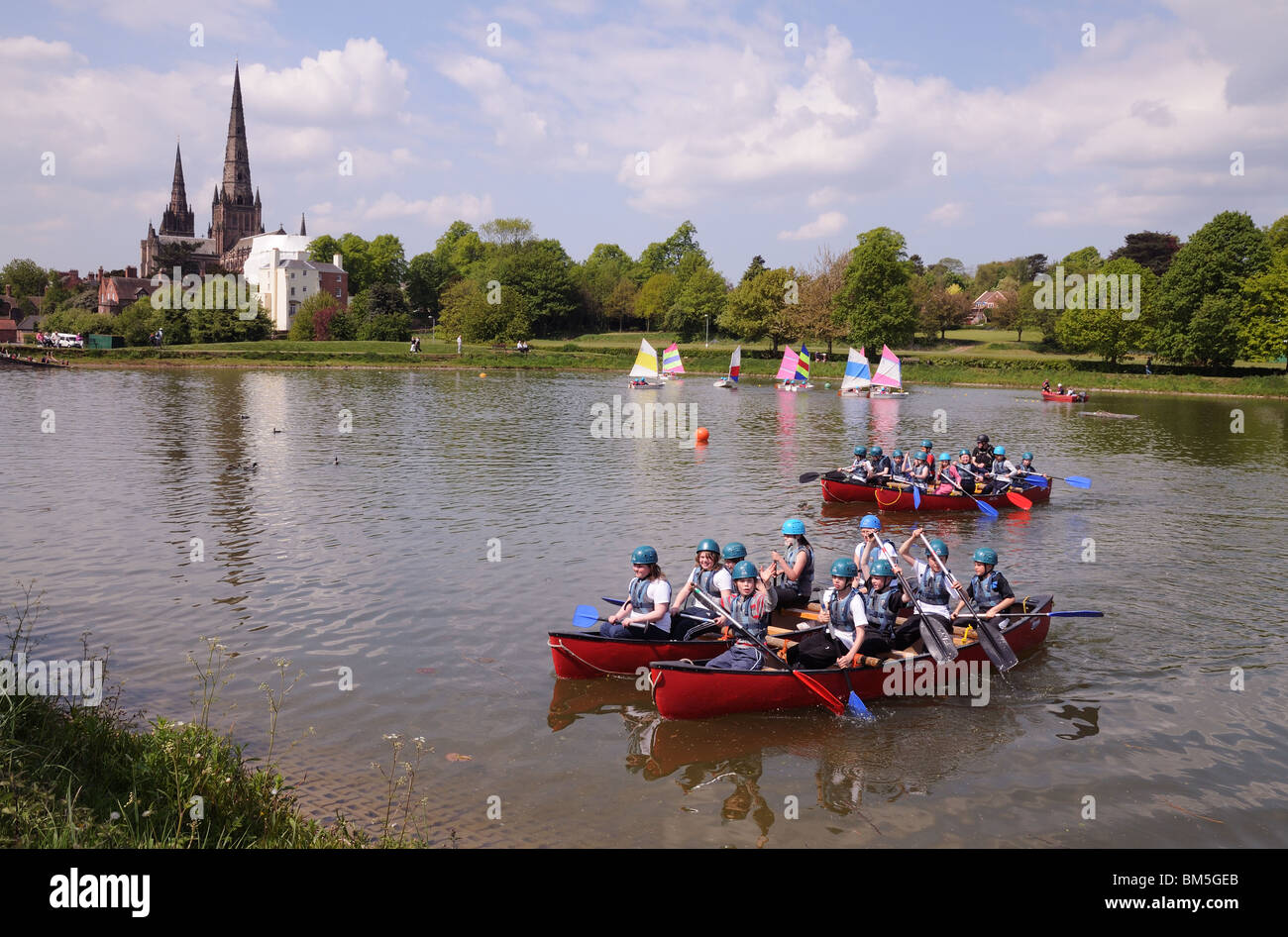 Lichfield Cathedral and Stowe Pool with children in sailing dinghies ...