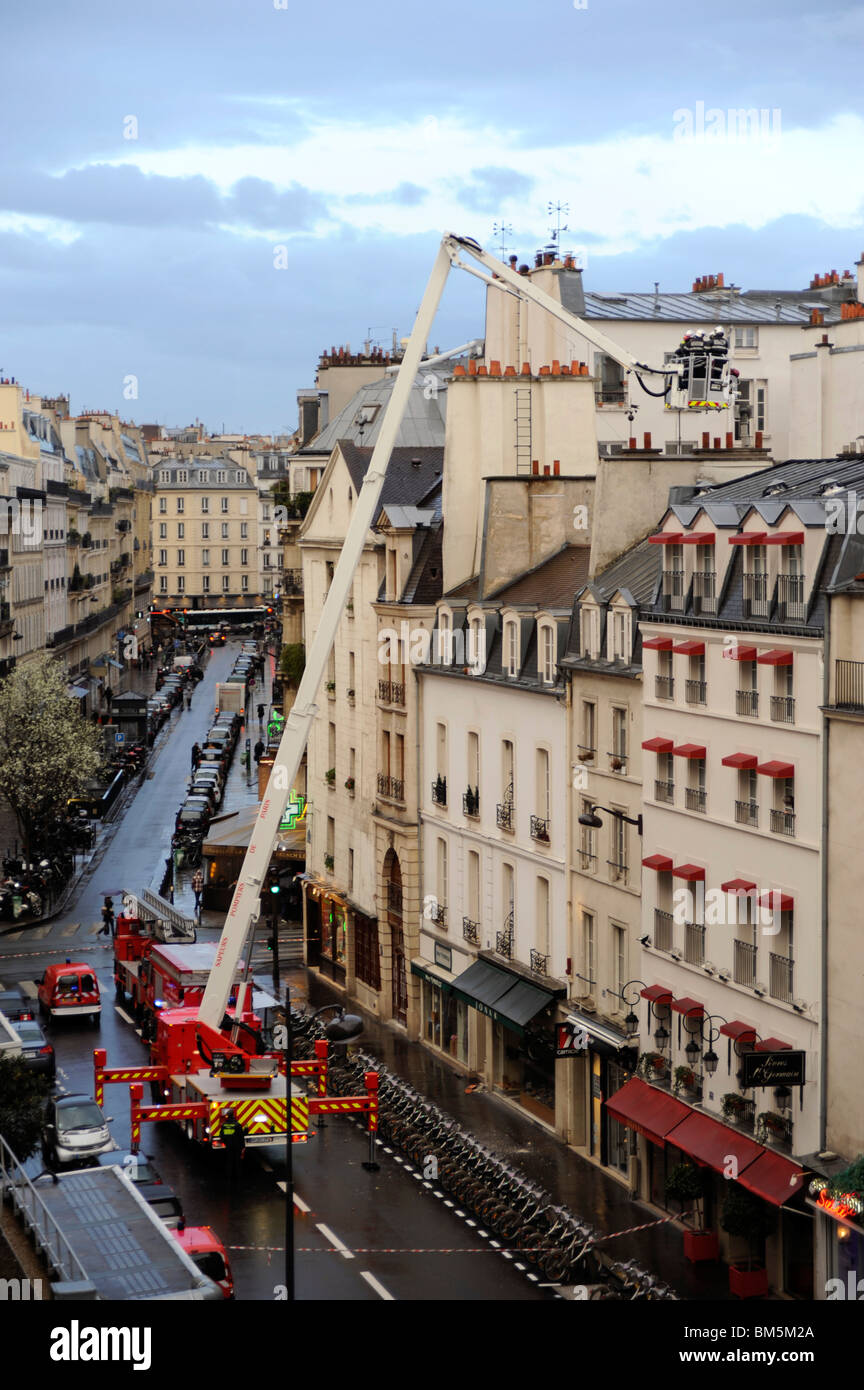 Fireman with telescopic aerial platform in rue saint placide street hi ...