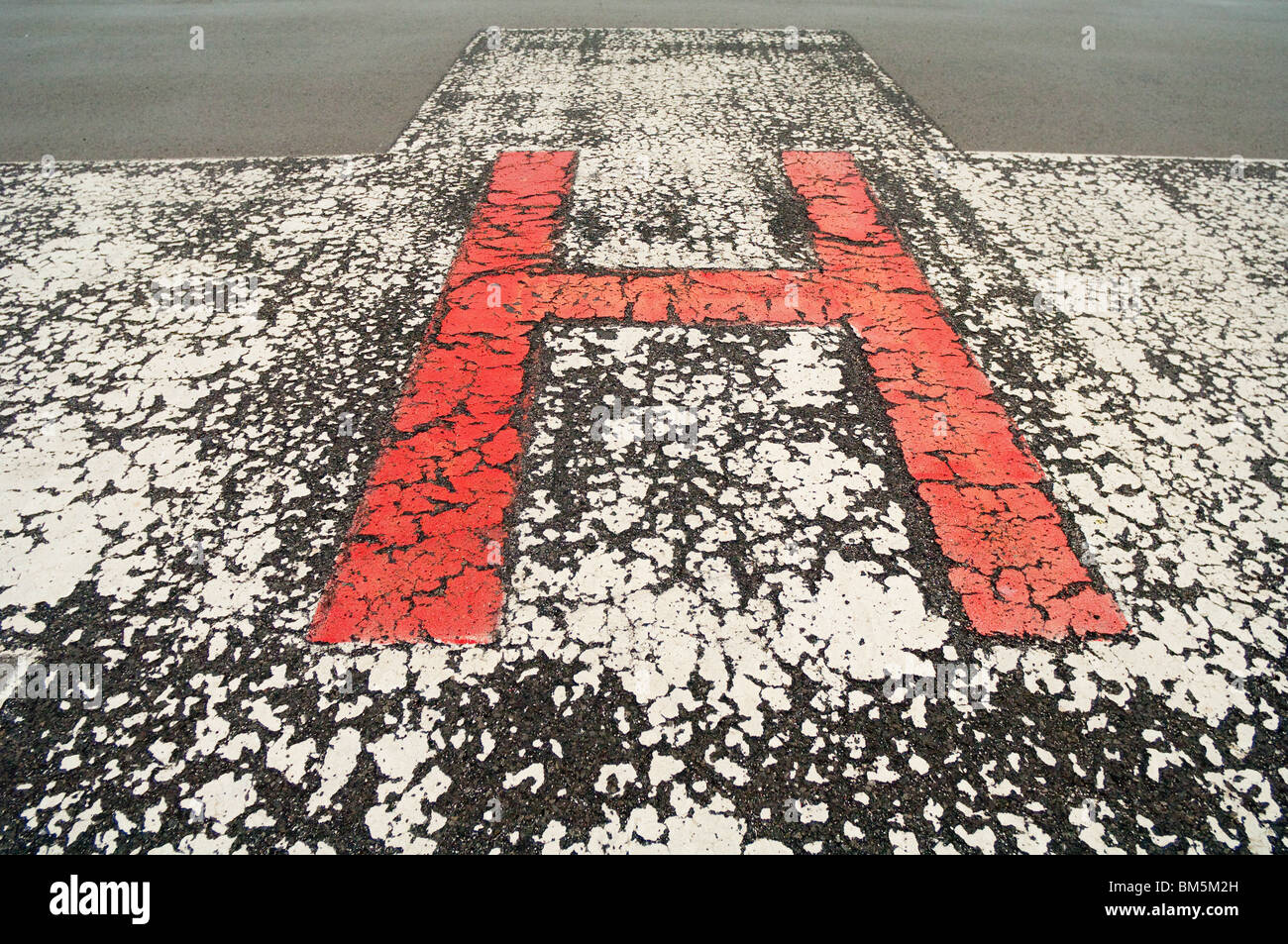 Image of a weathered heliport landing pad used in the transport of ...