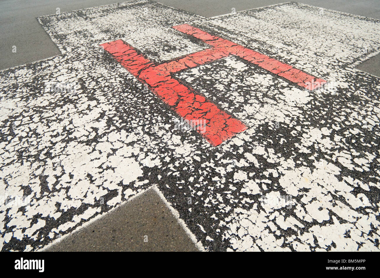 Image of a weathered heliport landing pad used in the transport of ...