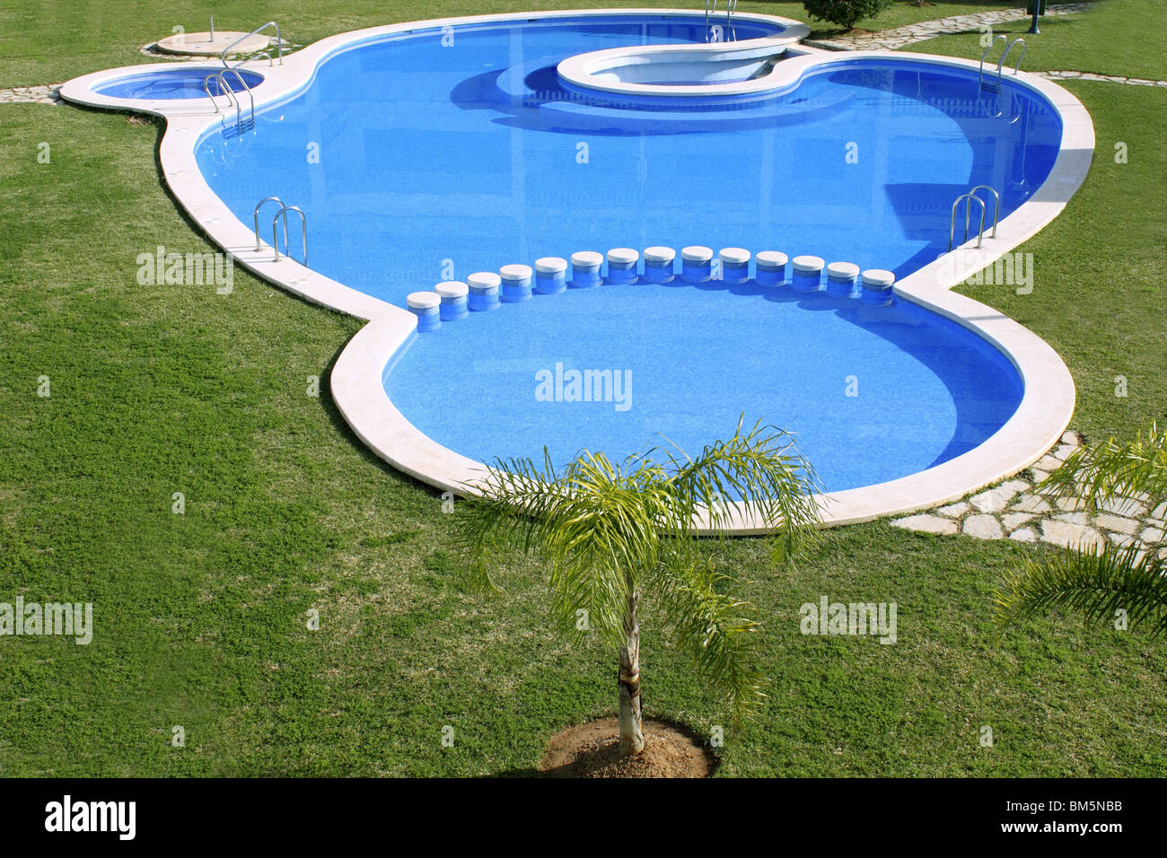 blue swimming pool round shapes and outdoor jacuzzi Stock Photo - Alamy