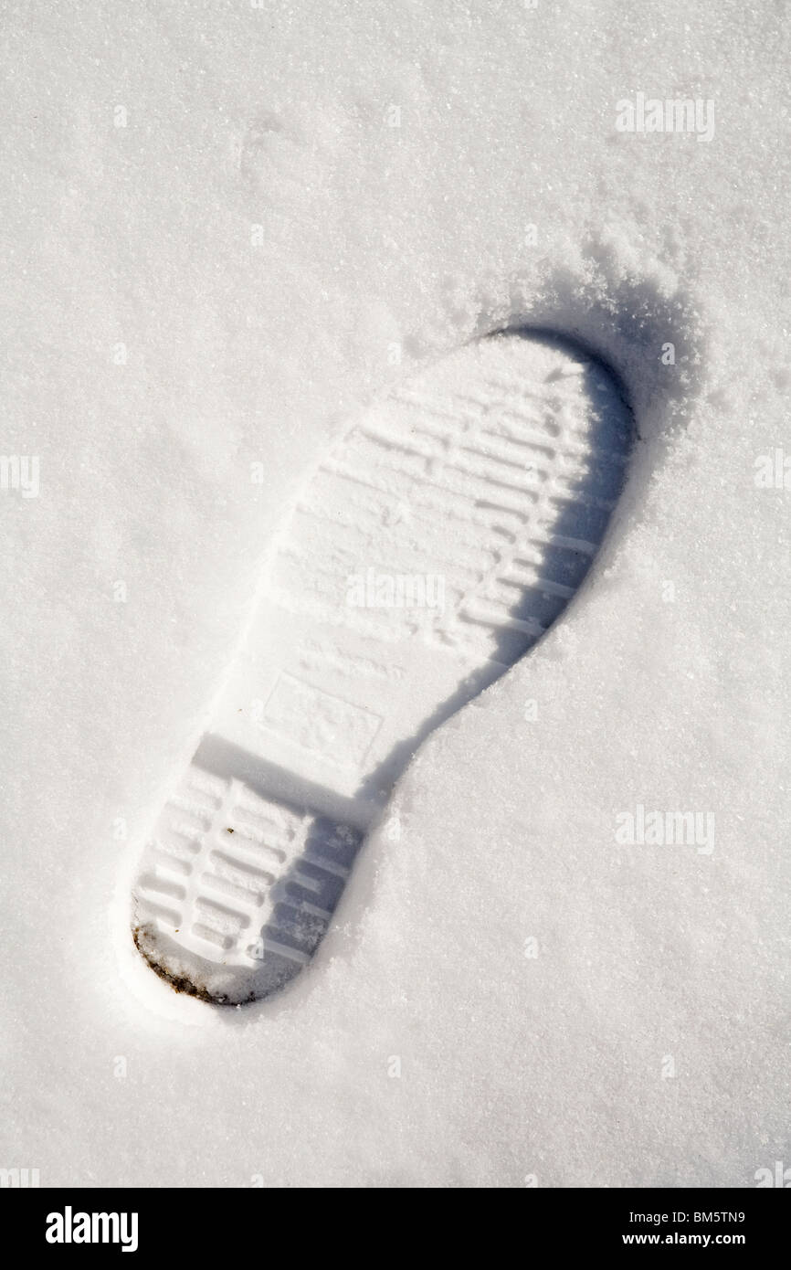 Footstep in snow Stock Photo - Alamy