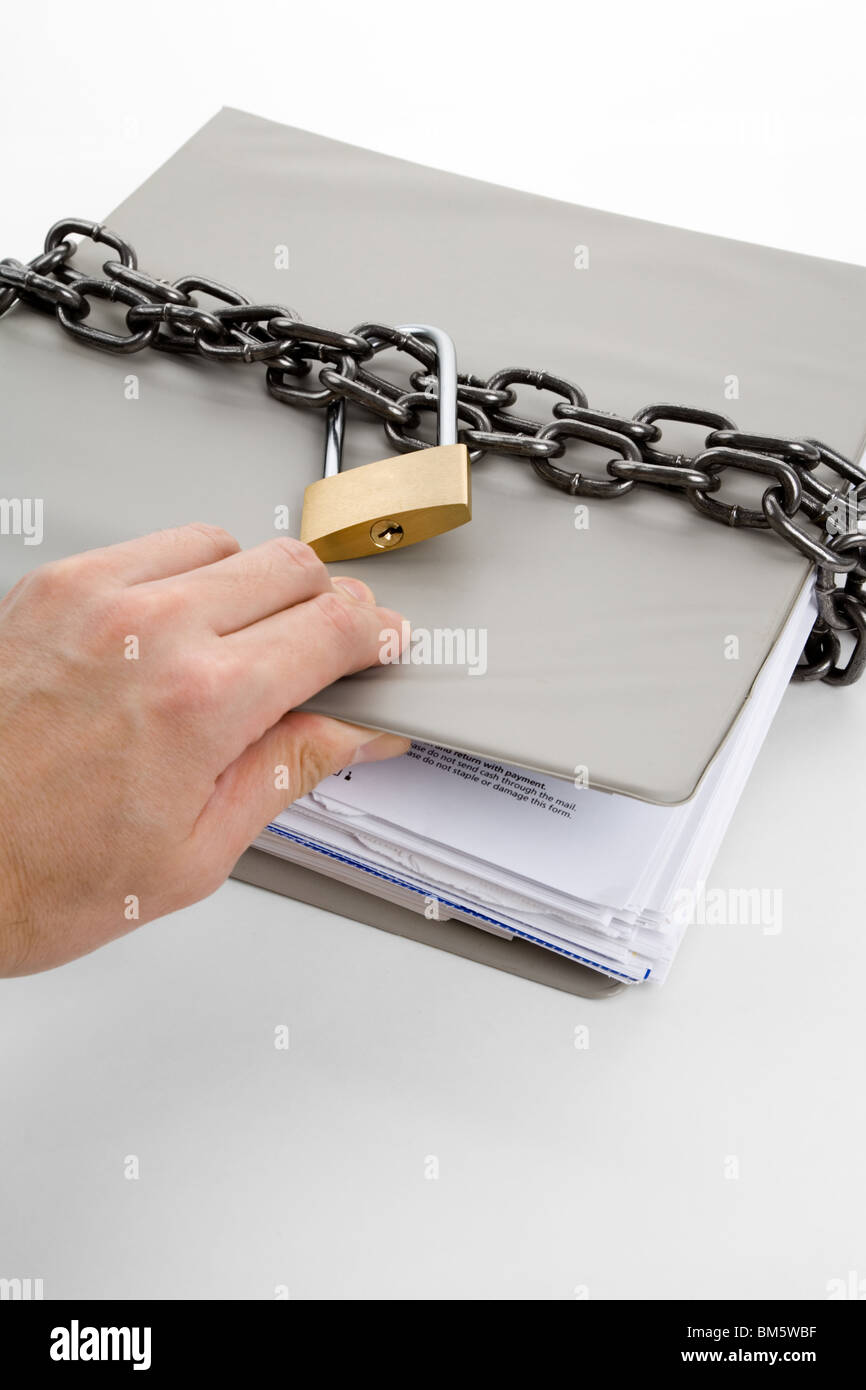 Lock and file folder, concept of Confidential Document Stock Photo - Alamy