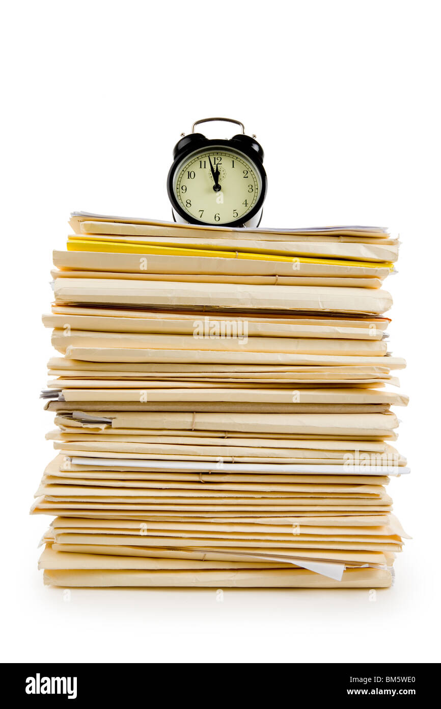 File Stack and clock with white background Stock Photo - Alamy