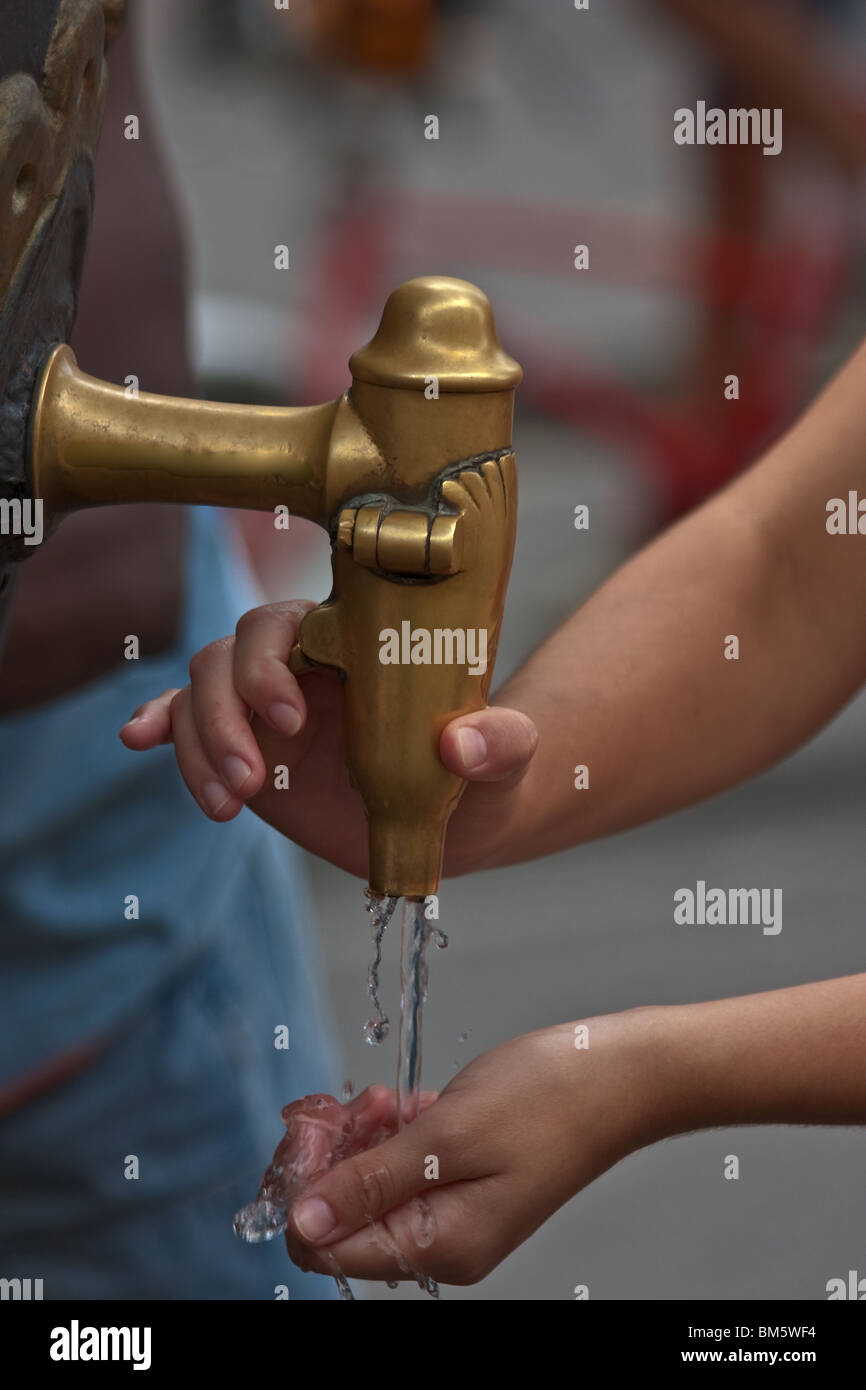 Refreshment at beautiful Barcelona water fauntain Stock Photo - Alamy