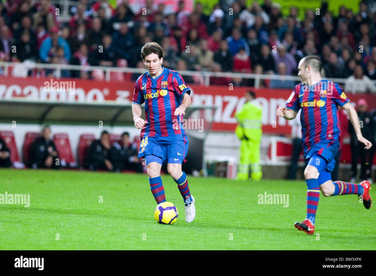 Messi with the ball before Iniesta Stock Photo - Alamy