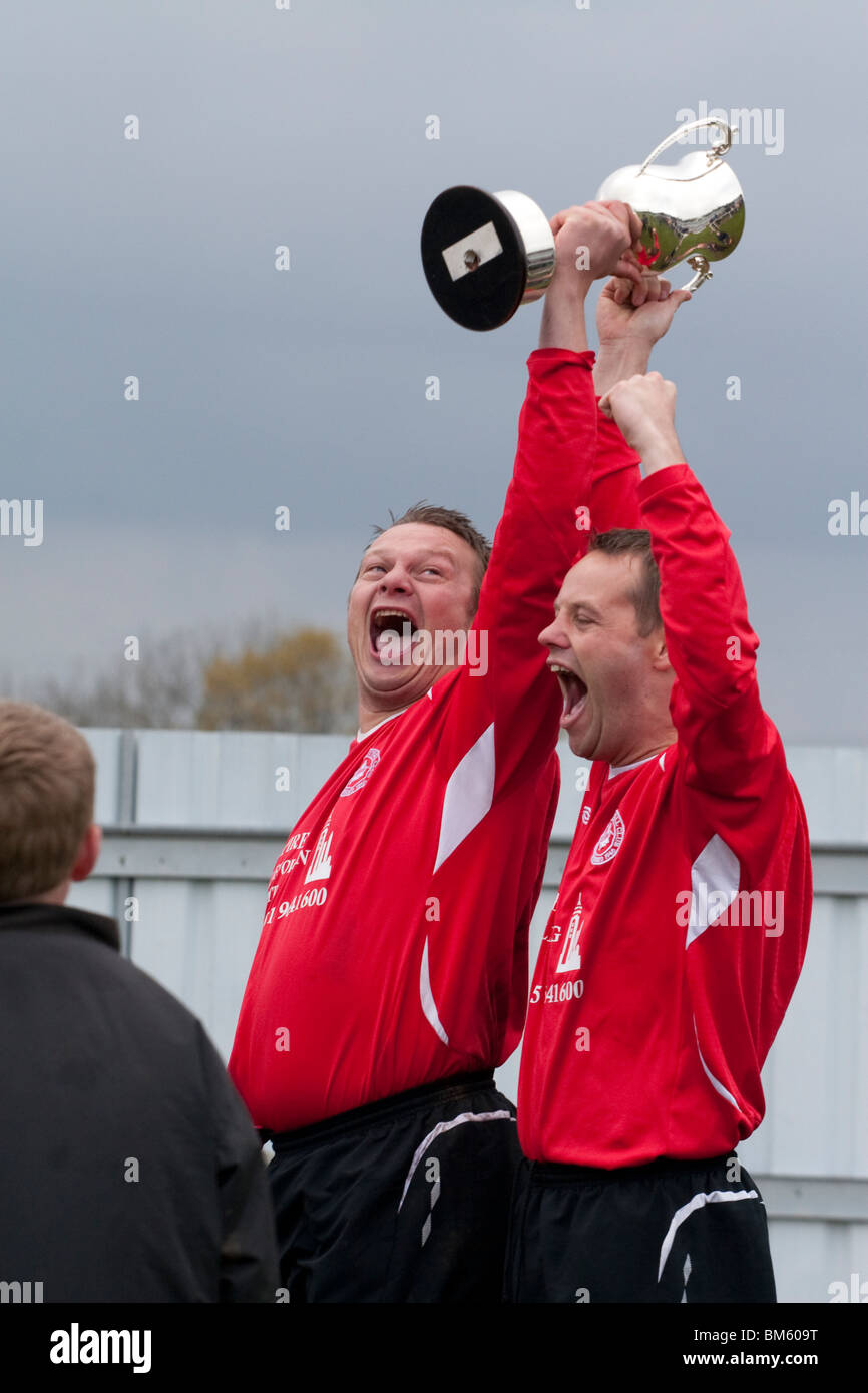 Sport football celebrating trophy medal hi-res stock photography and ...