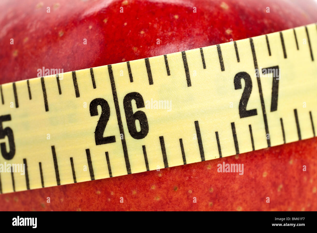 Red apple and Tape Measure close up Stock Photo - Alamy