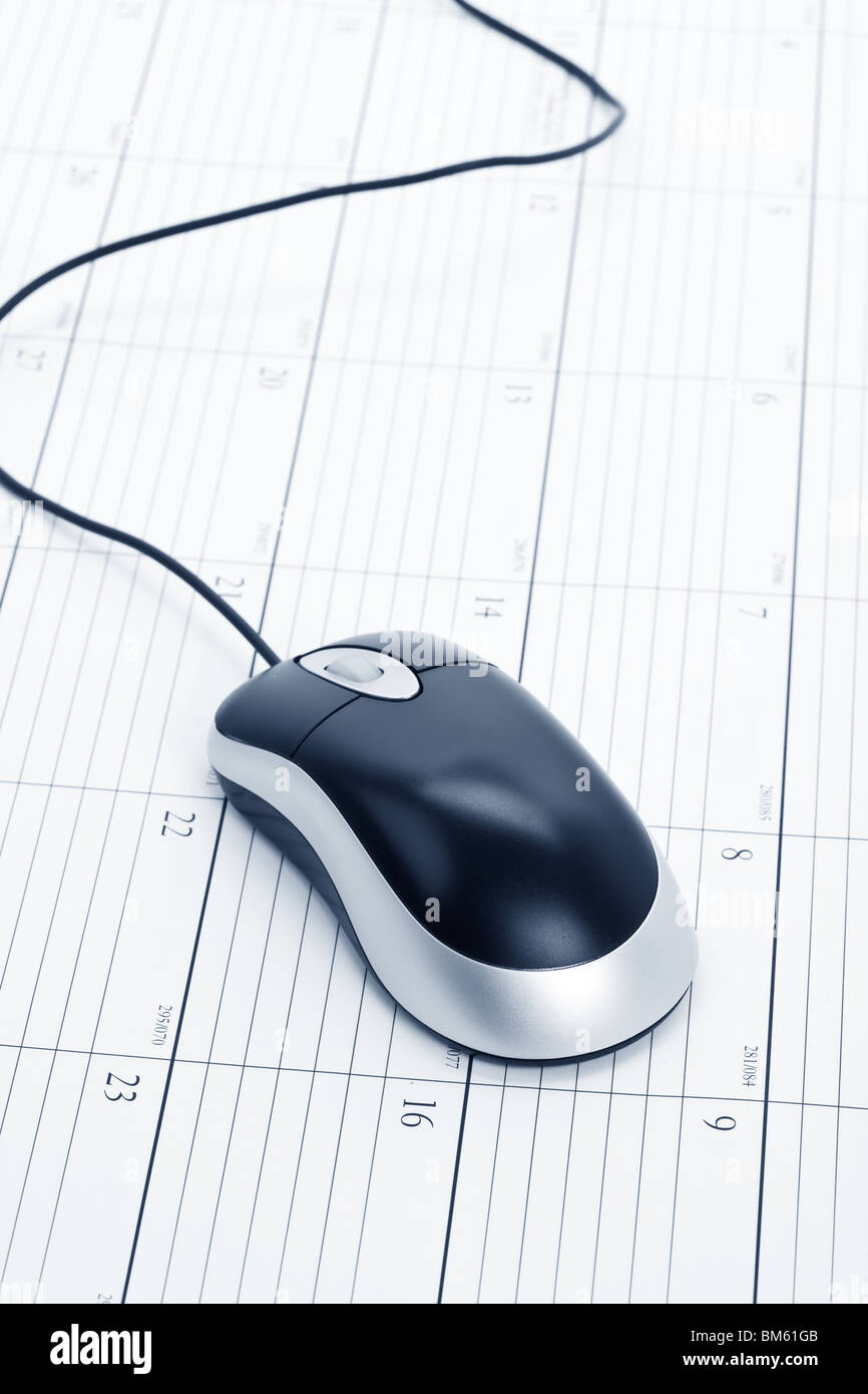 Computer Mouse and Calendar close up Stock Photo - Alamy