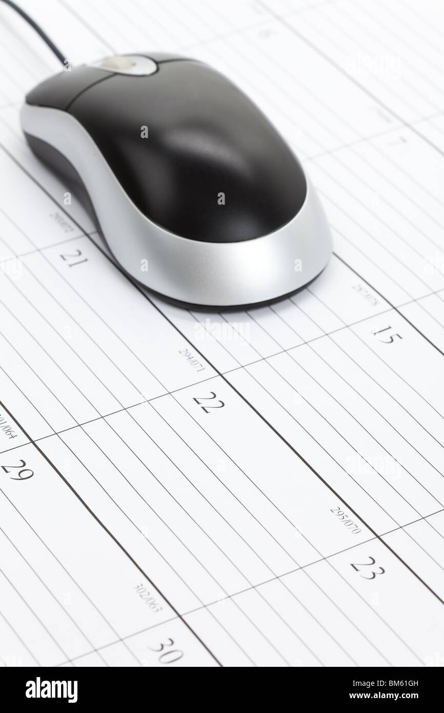Computer Mouse and Calendar close up Stock Photo - Alamy