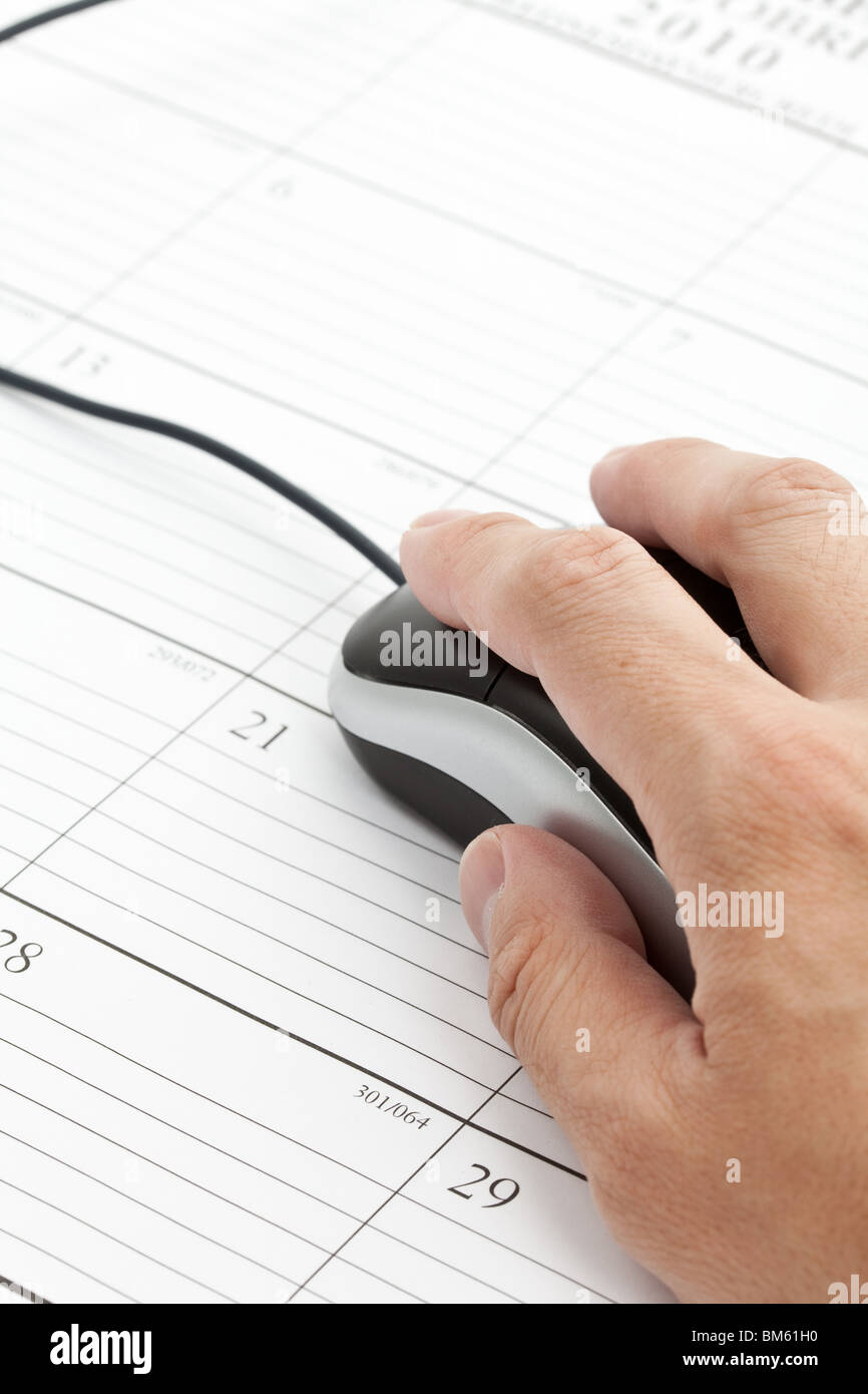Computer Mouse and Calendar close up Stock Photo - Alamy