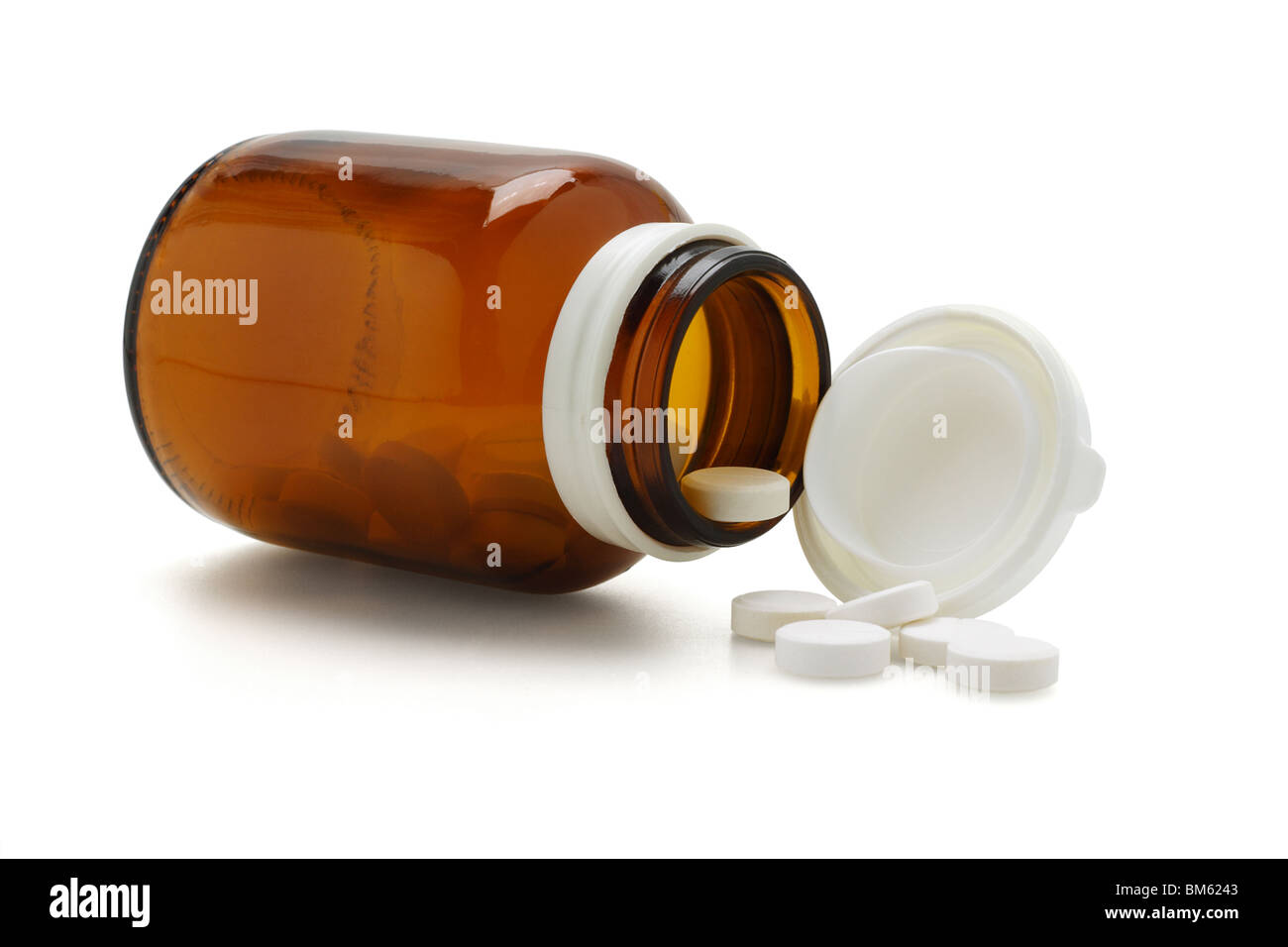Pill bottle lying open Cut Out Stock Images & Pictures - Alamy