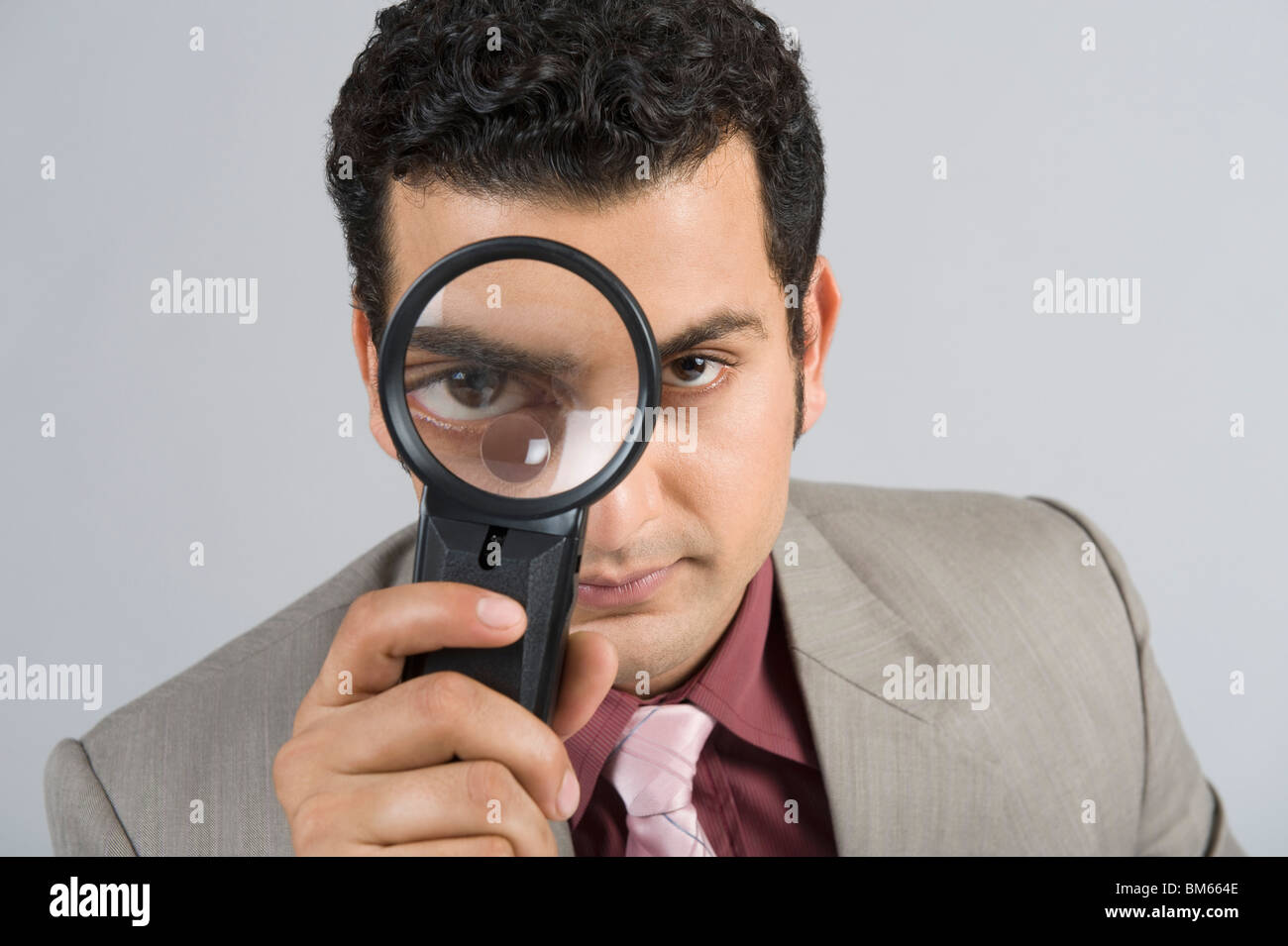 Looking with magnifying glass hi-res stock photography and images - Alamy