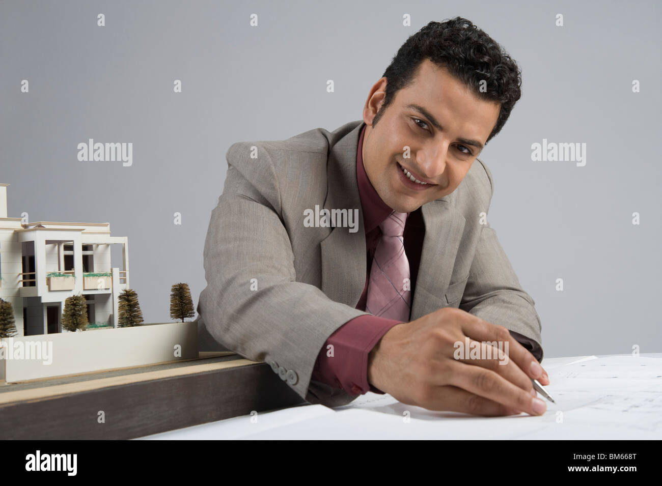 Portrait young architect looking architectural model office hi-res ...