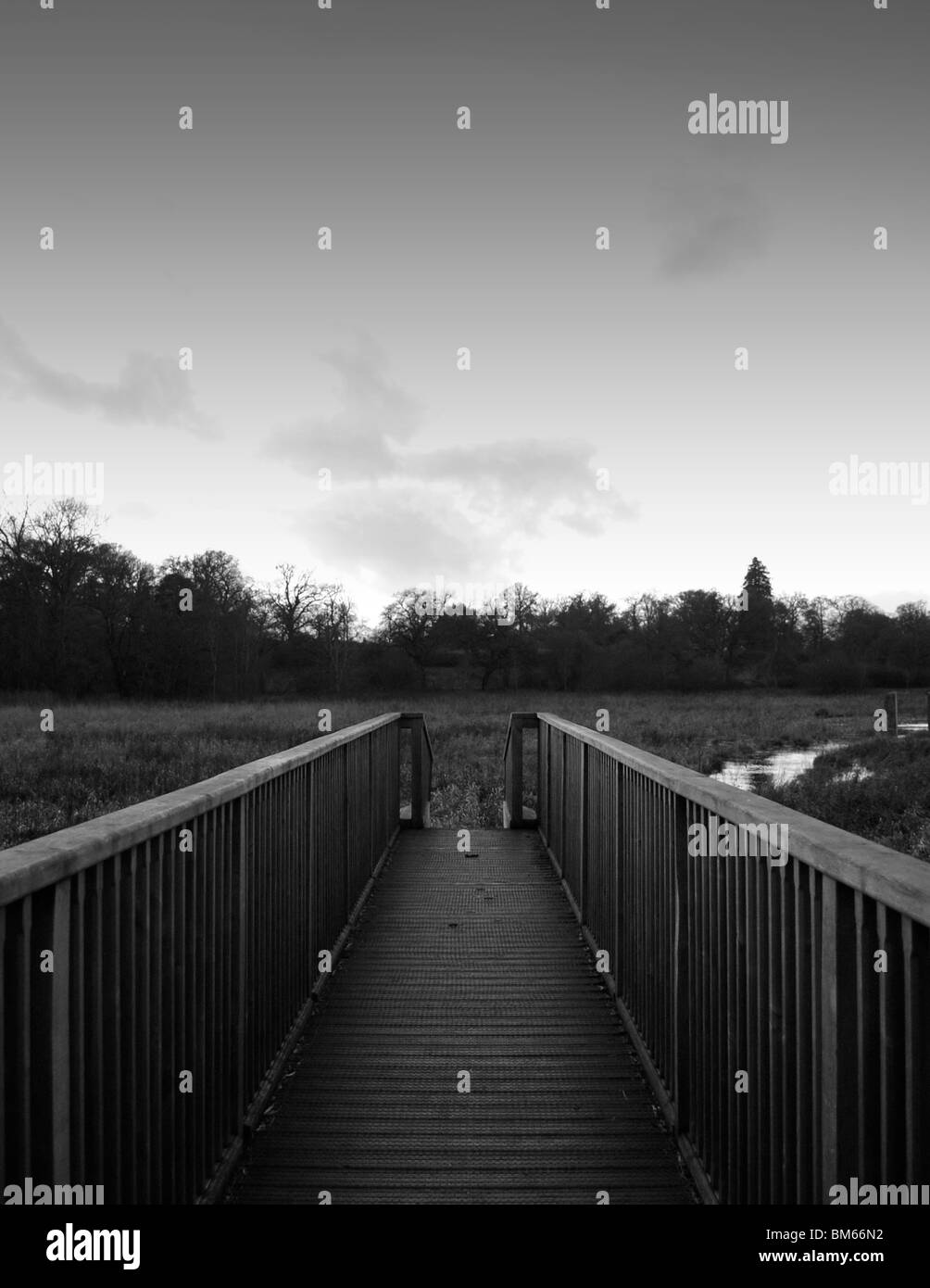 Bridge to a field Stock Photo - Alamy