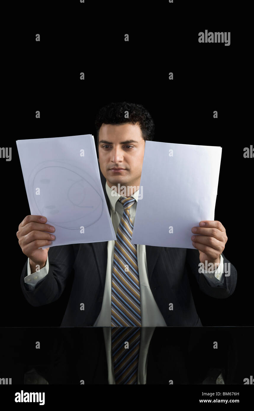 Sitting looking holding document authority hi-res stock photography and ...