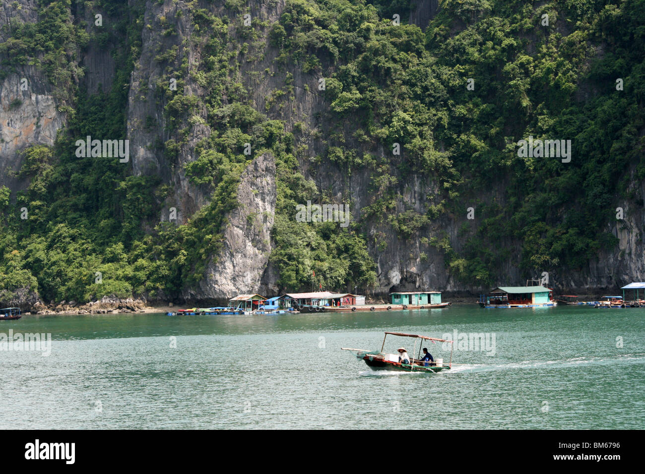 Floating village in Halong Bay, Vietnam Stock Photo - Alamy