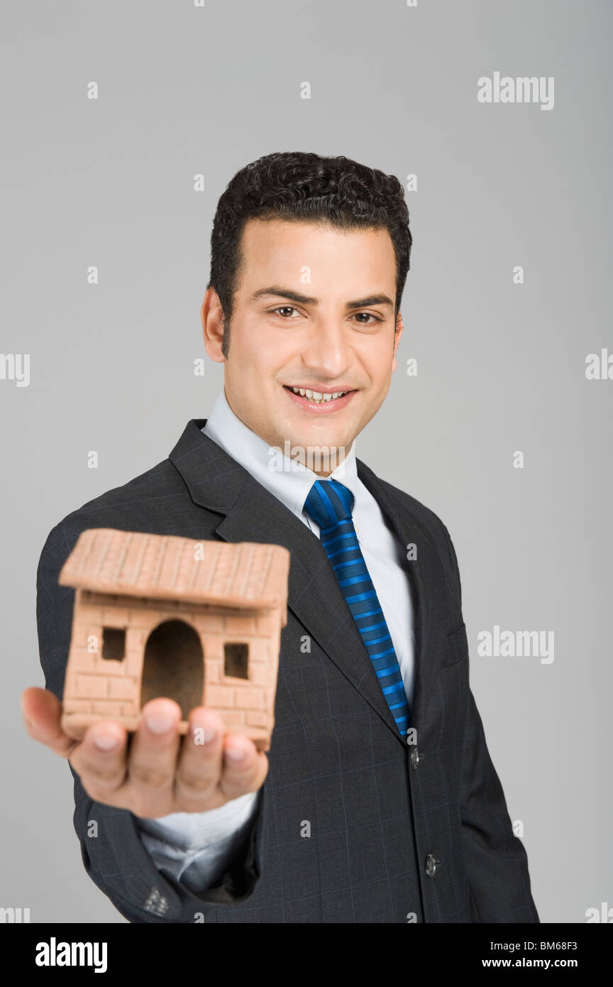 Businessperson looking house model hi-res stock photography and images ...