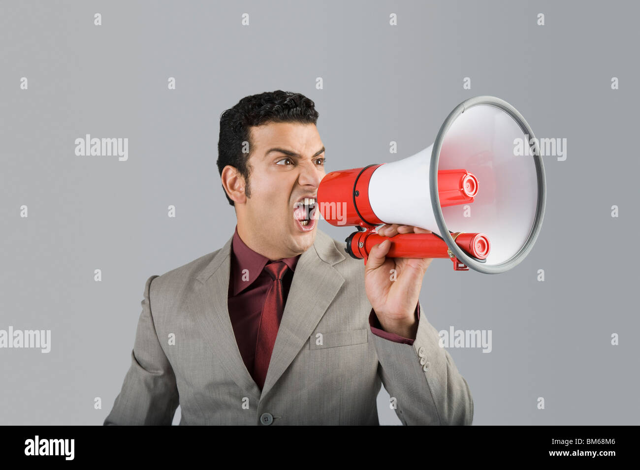 Asian business man shout megaphone hi-res stock photography and images ...