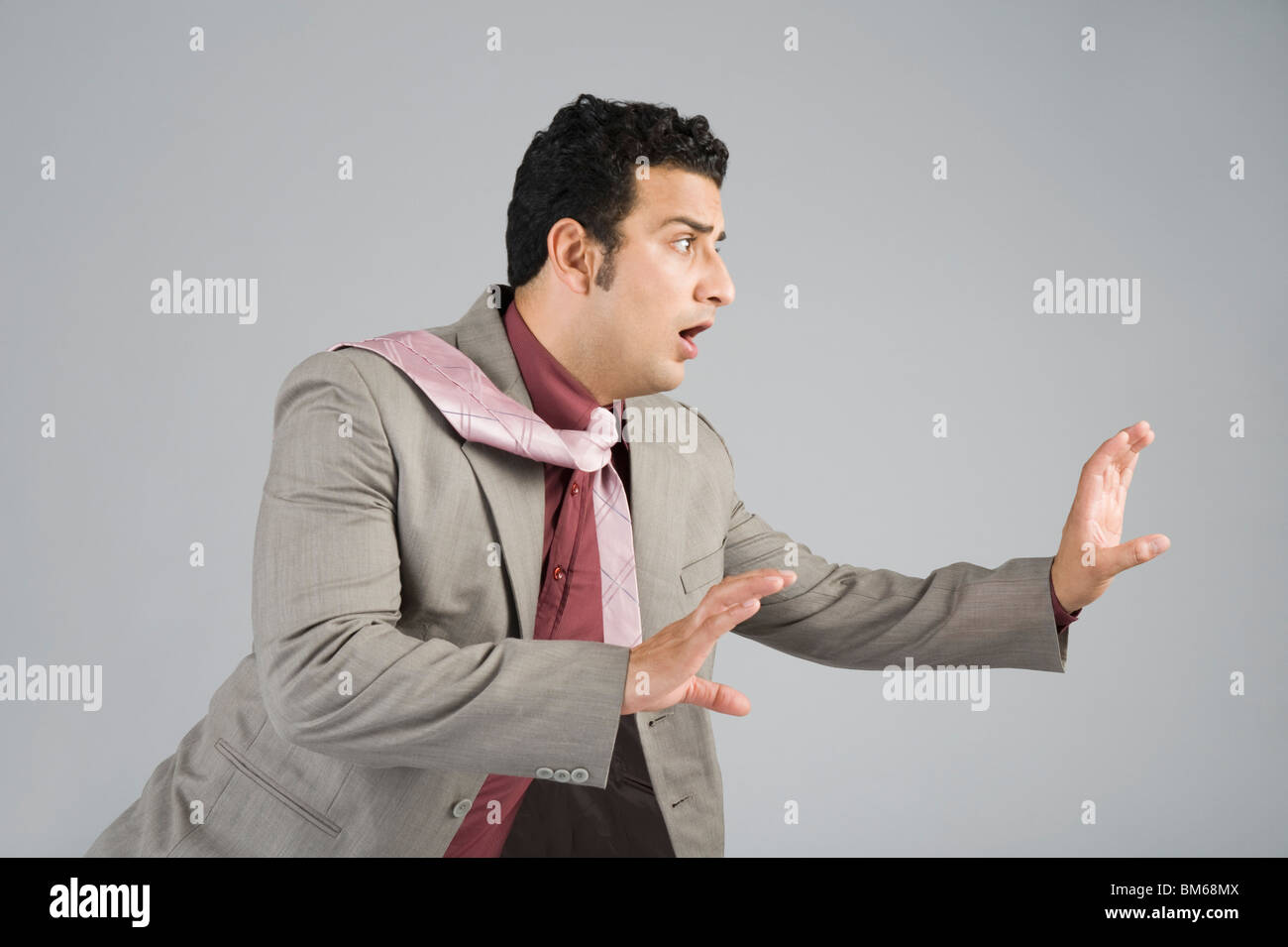 Businessman looking scared Stock Photo - Alamy
