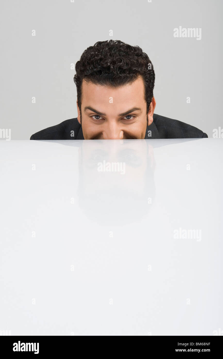 Peeking over desk hi-res stock photography and images - Alamy