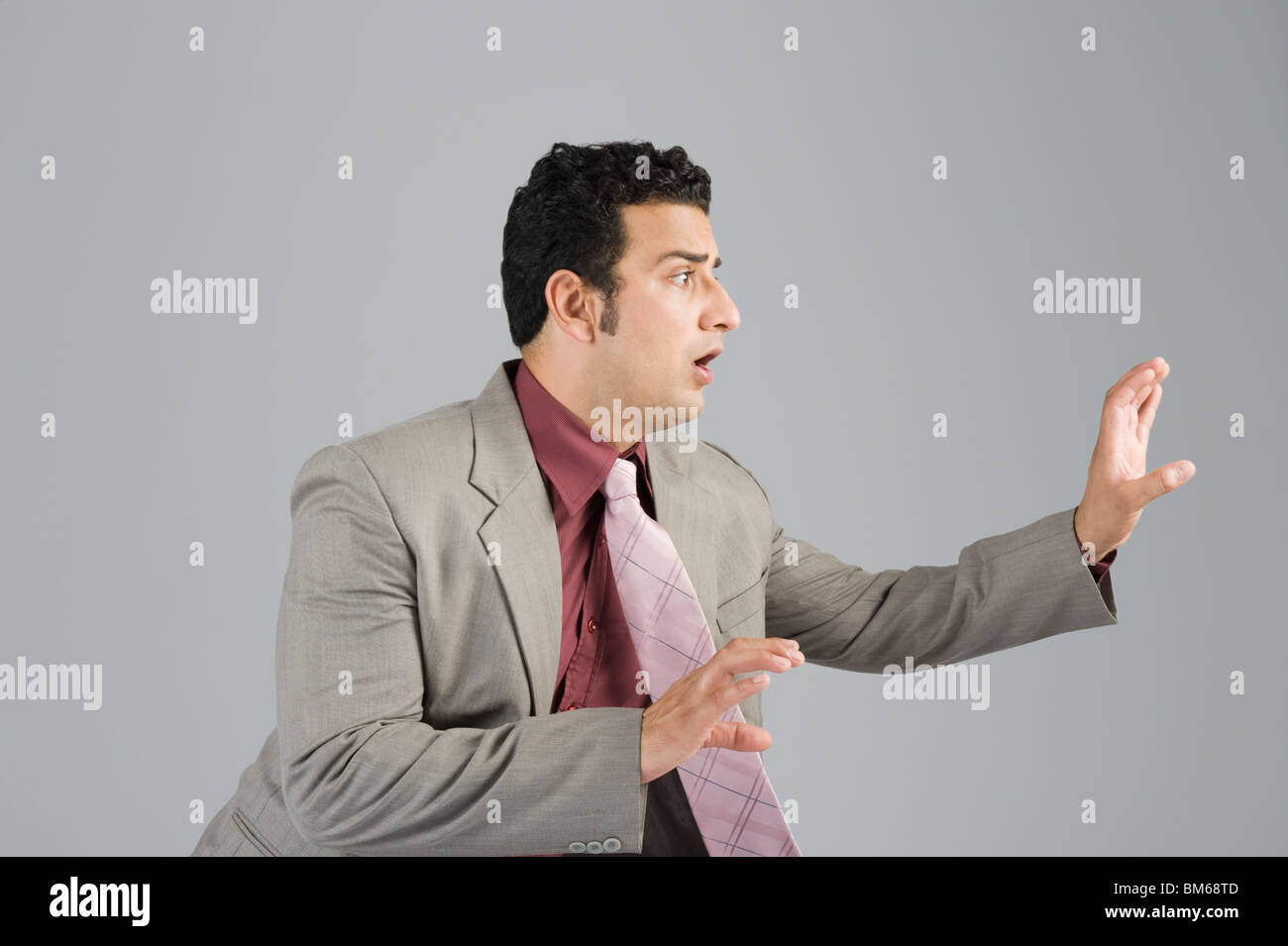 Businessman looking scared Stock Photo - Alamy
