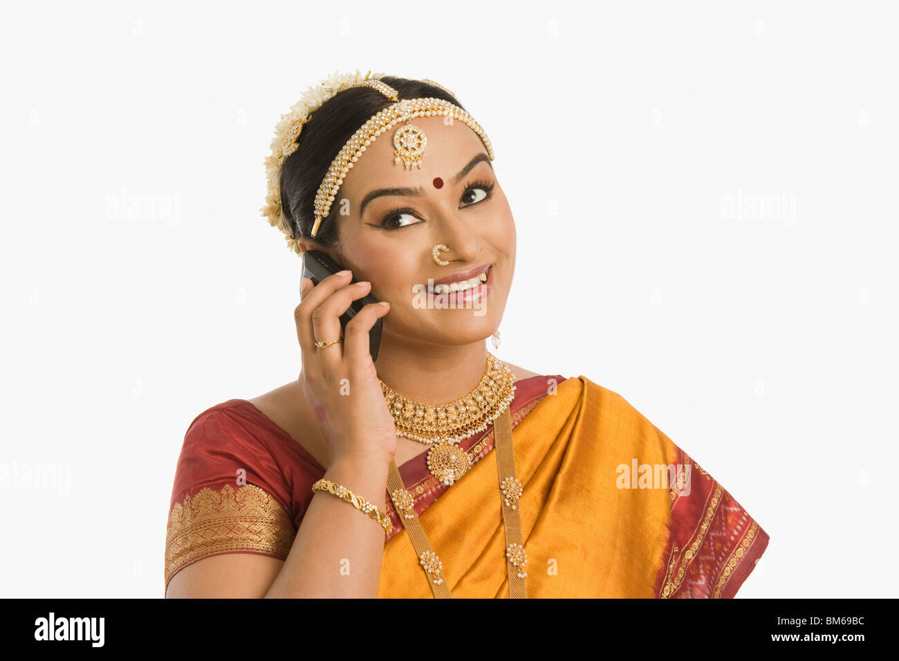 South Indian woman talking on a mobile phone Stock Photo - Alamy