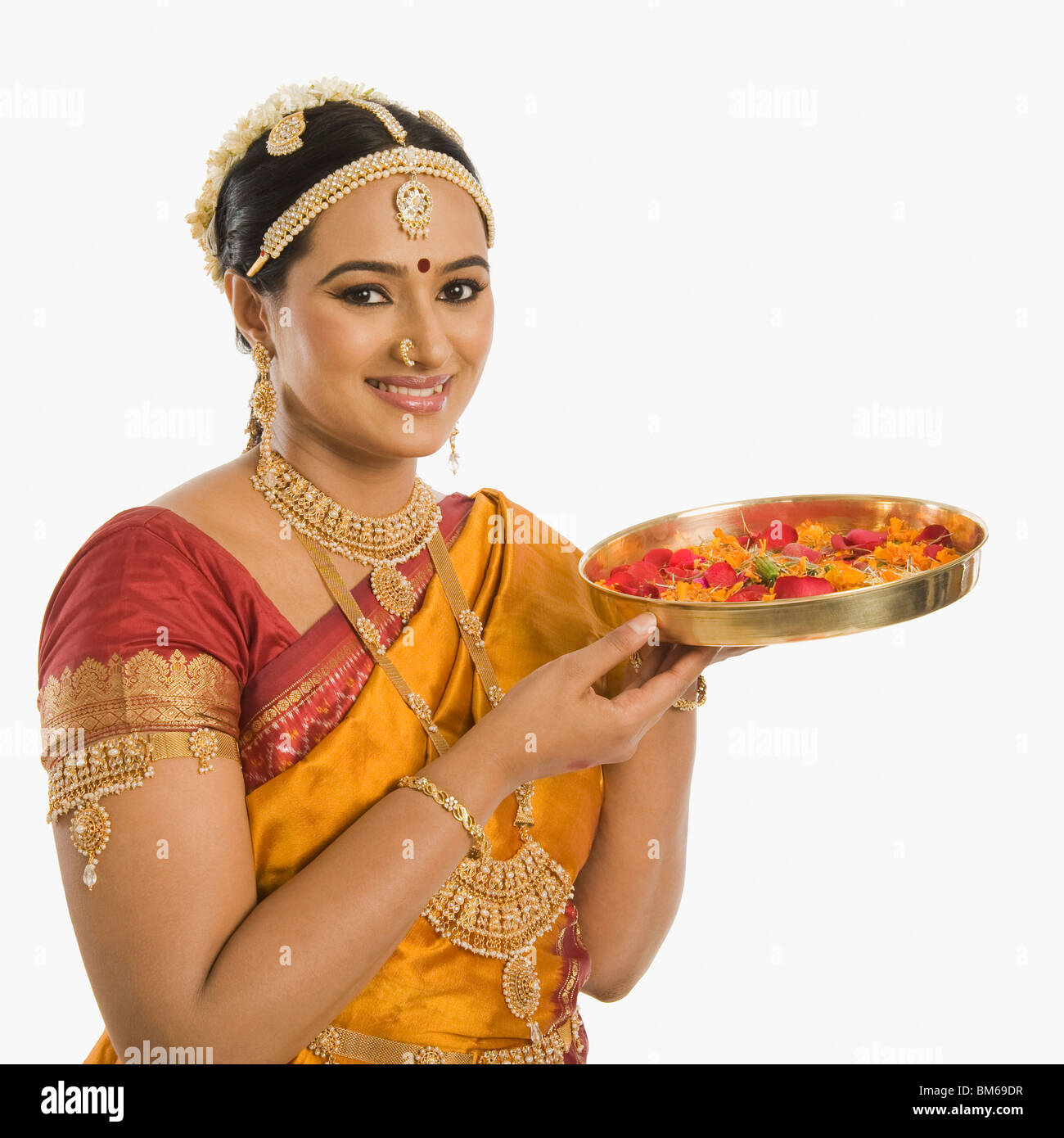 South indian woman holding pooja hi-res stock photography and images ...