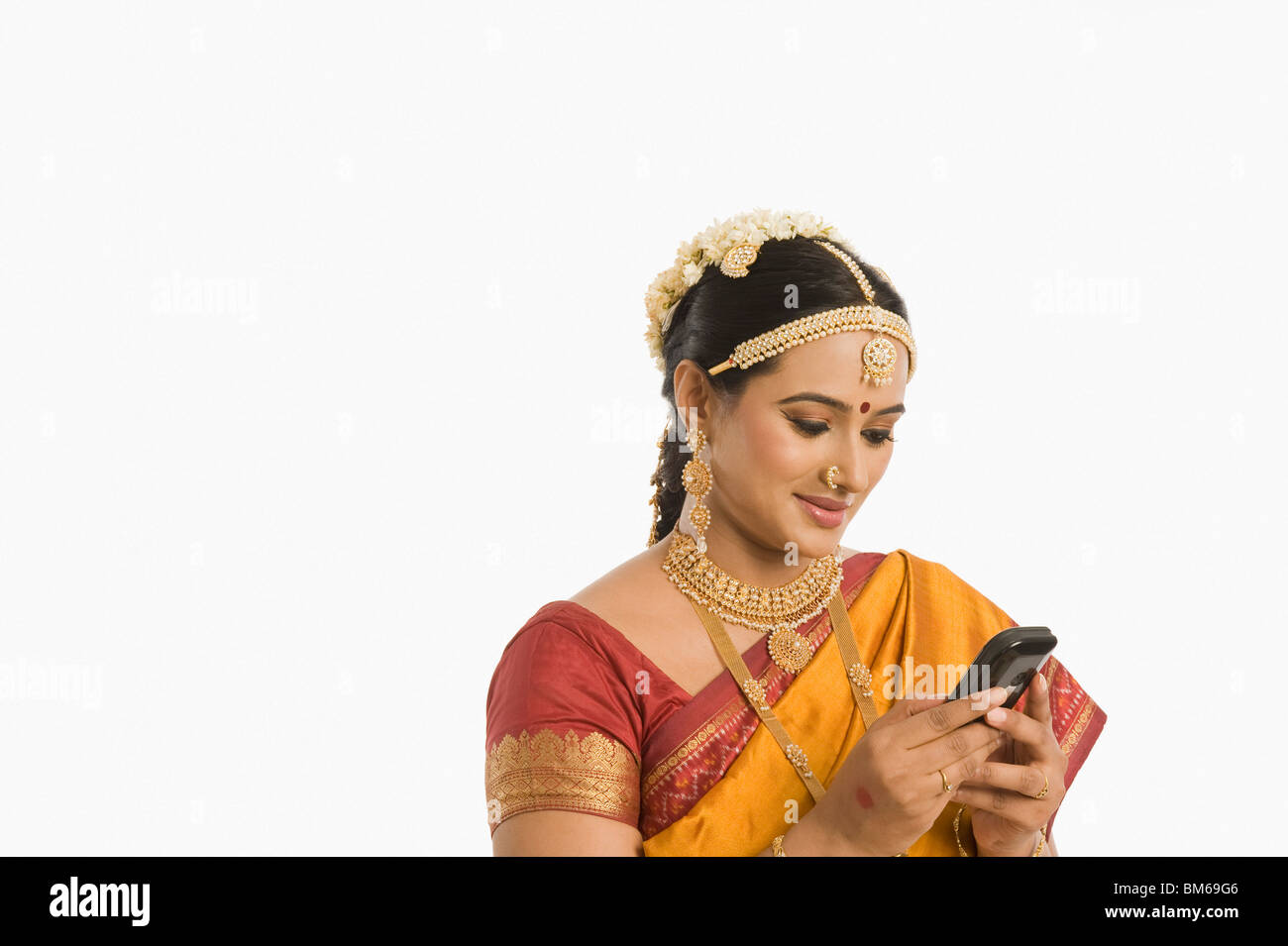 South Indian woman using a mobile phone Stock Photo - Alamy
