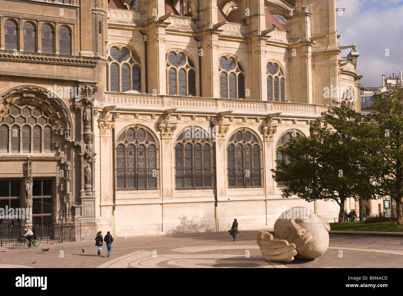 Statue in front of the Saint Eustache Church in the Halles District ...