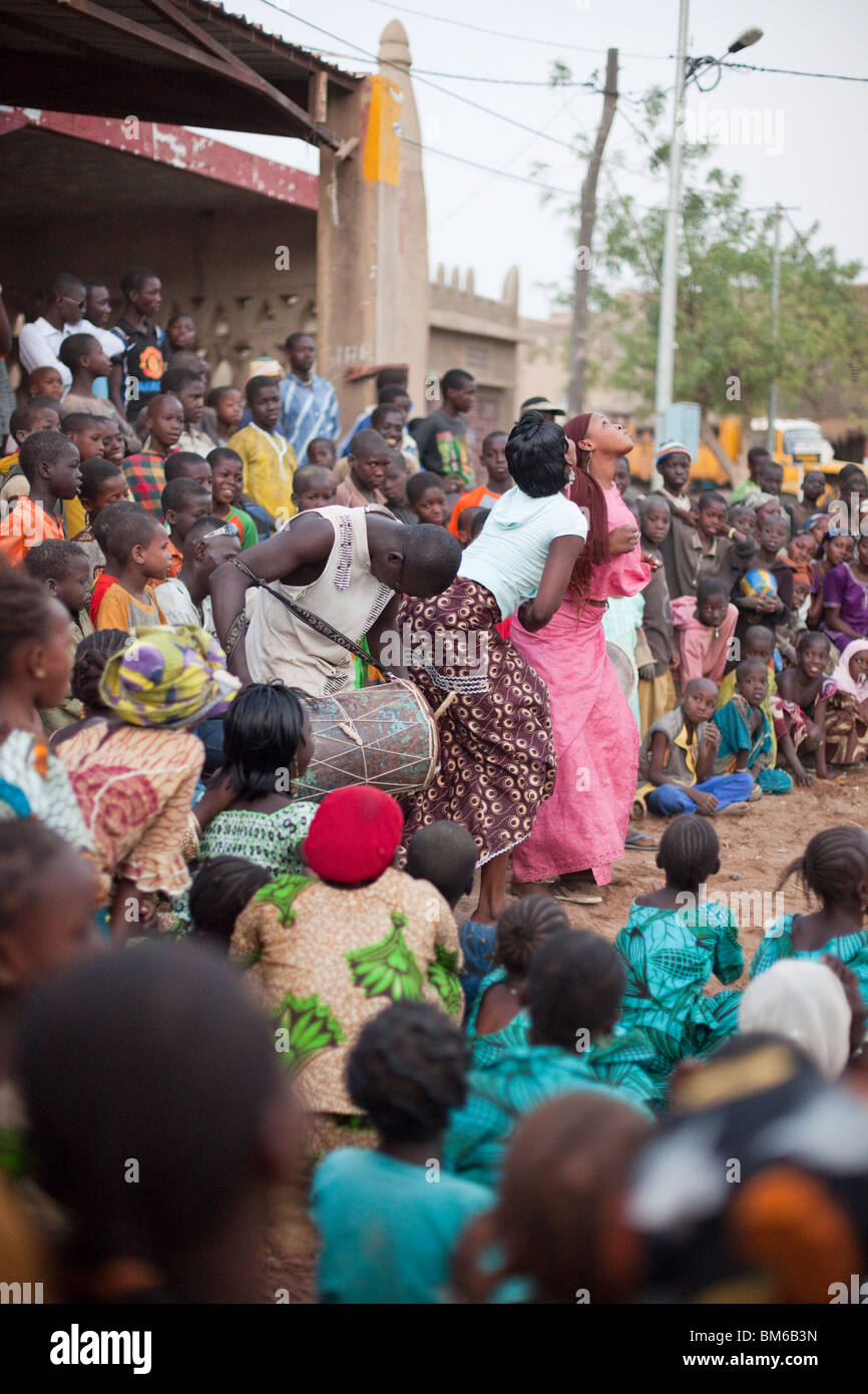 Women dance in a traditional dance circle in honor of the arrival of ...