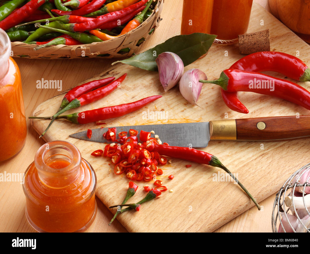 Making chilli sauce on a kitchen worktop Stock Photo - Alamy