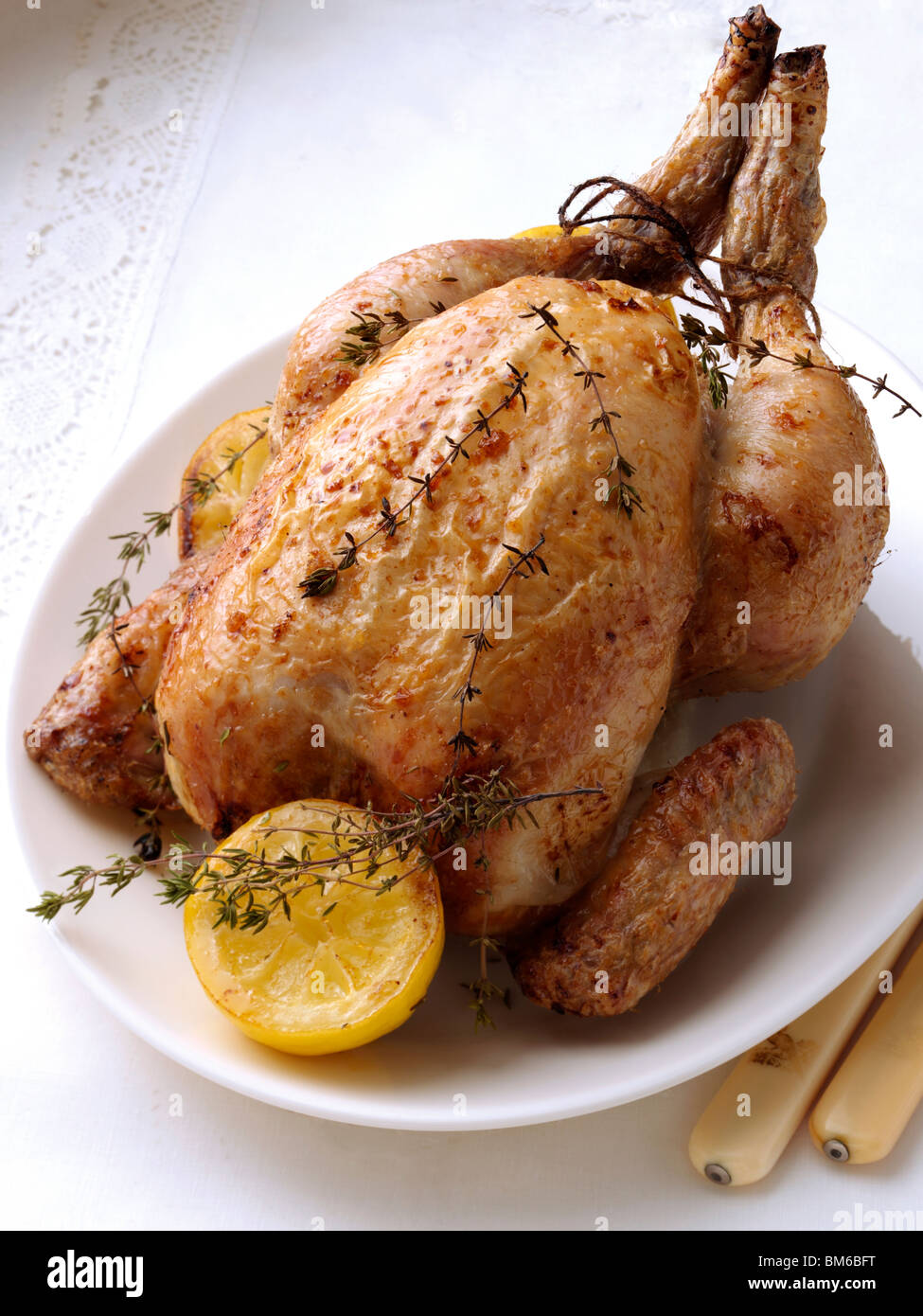 Whole Mediterranean style roast chicken Stock Photo - Alamy