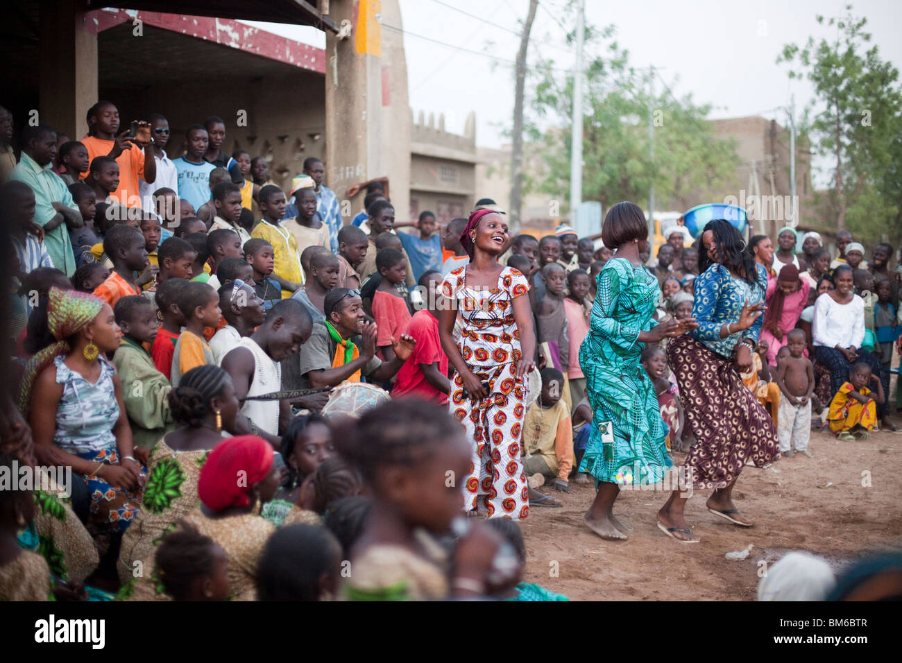 Women dance in a traditional dance circle in honor of the arrival of ...