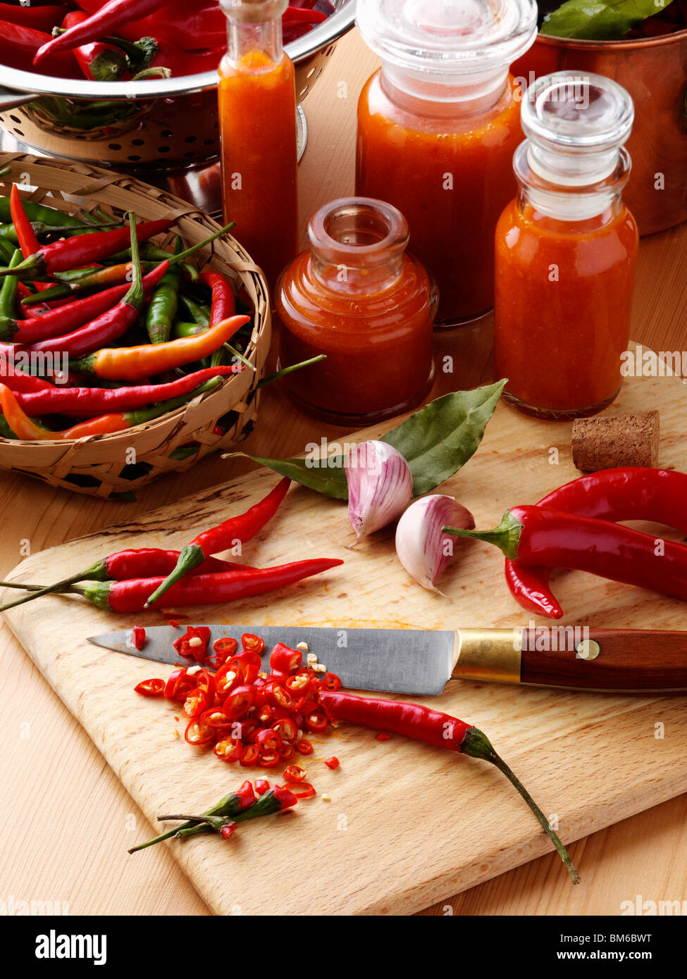 Making chilli sauce on a kitchen worktop Stock Photo - Alamy