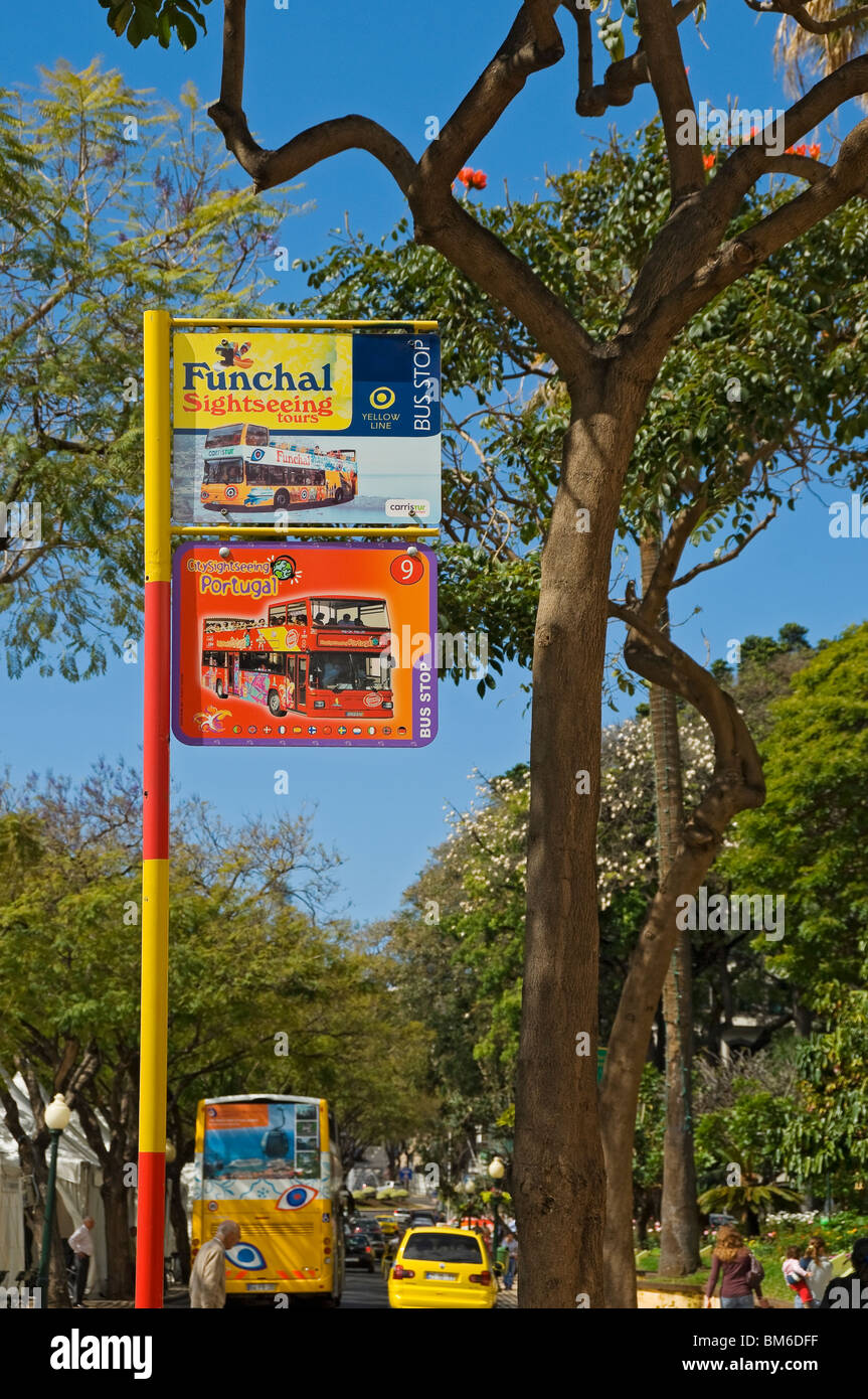 Close up of sightseeing tour tours tourist tourism bus stop sign signs ...