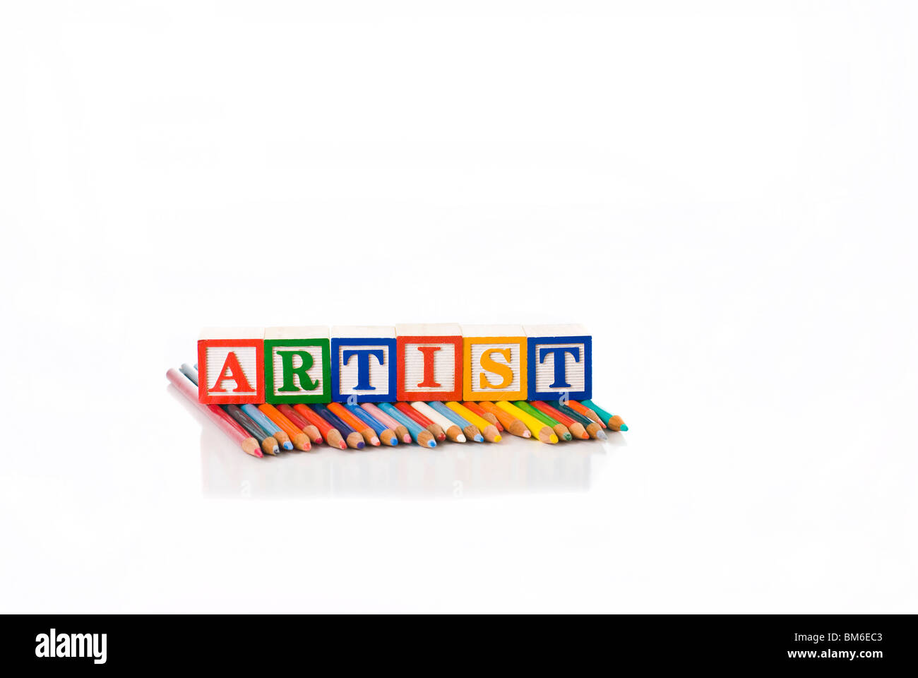 Colorful children's blocks spelling the word ARTIST with colored ...