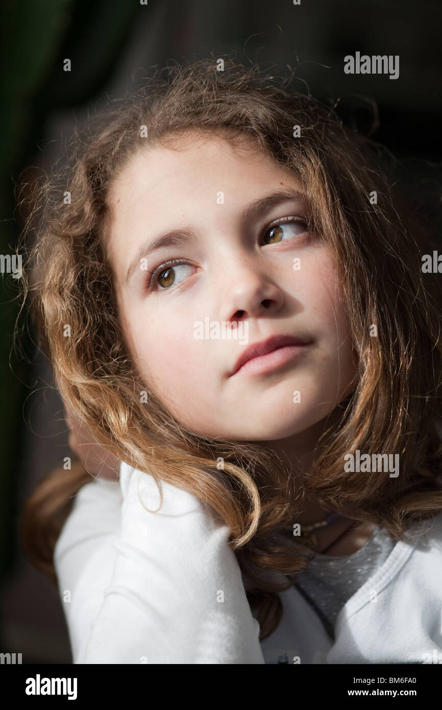 Thoughtful child in a pensive mood Stock Photo - Alamy