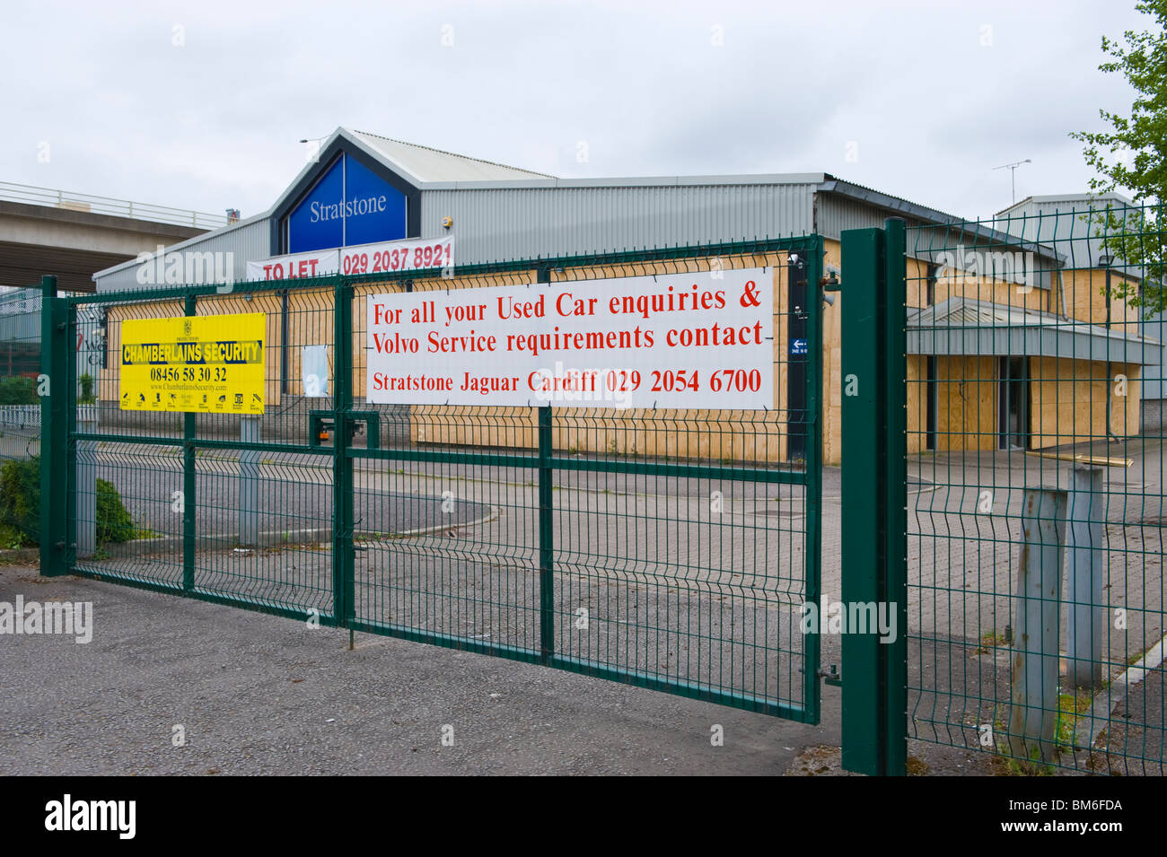Boarded up former car showroom in Cardiff South Wales UK Stock Photo ...