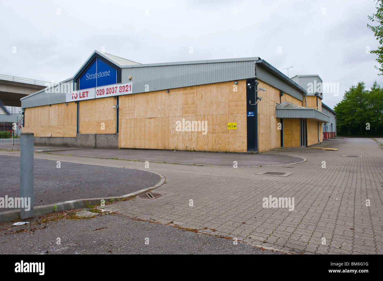 Boarded up former car showroom in Cardiff South Wales UK Stock Photo ...