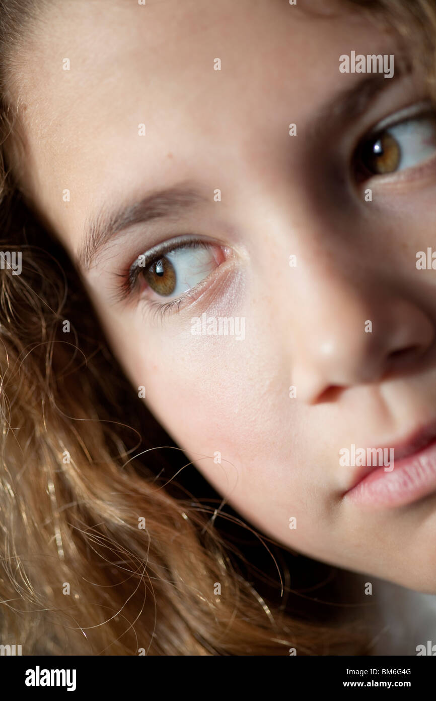 Thoughtful child in a pensive mood girl young face Stock Photo - Alamy