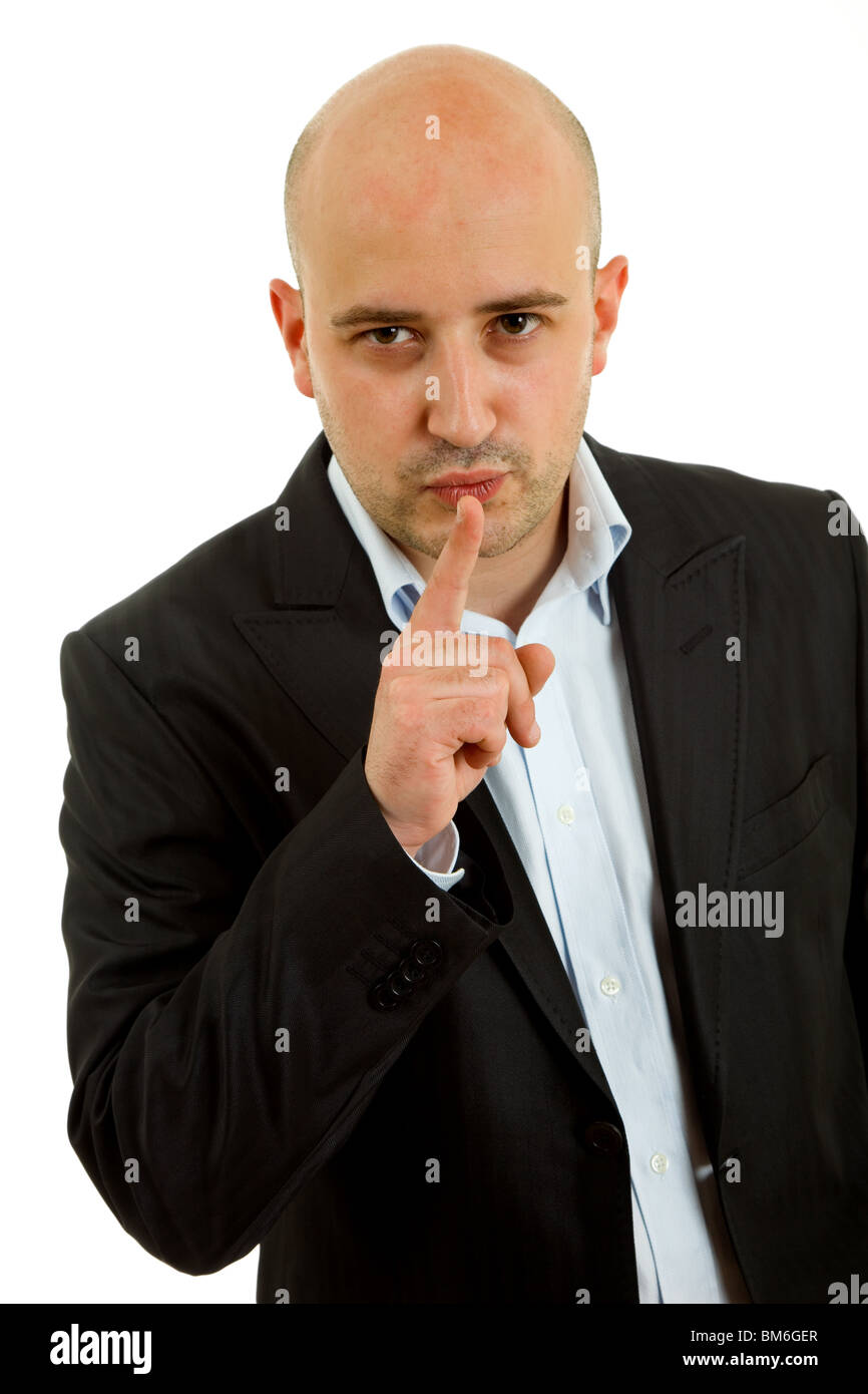 Serious male with silence hand gesture hi-res stock photography and ...