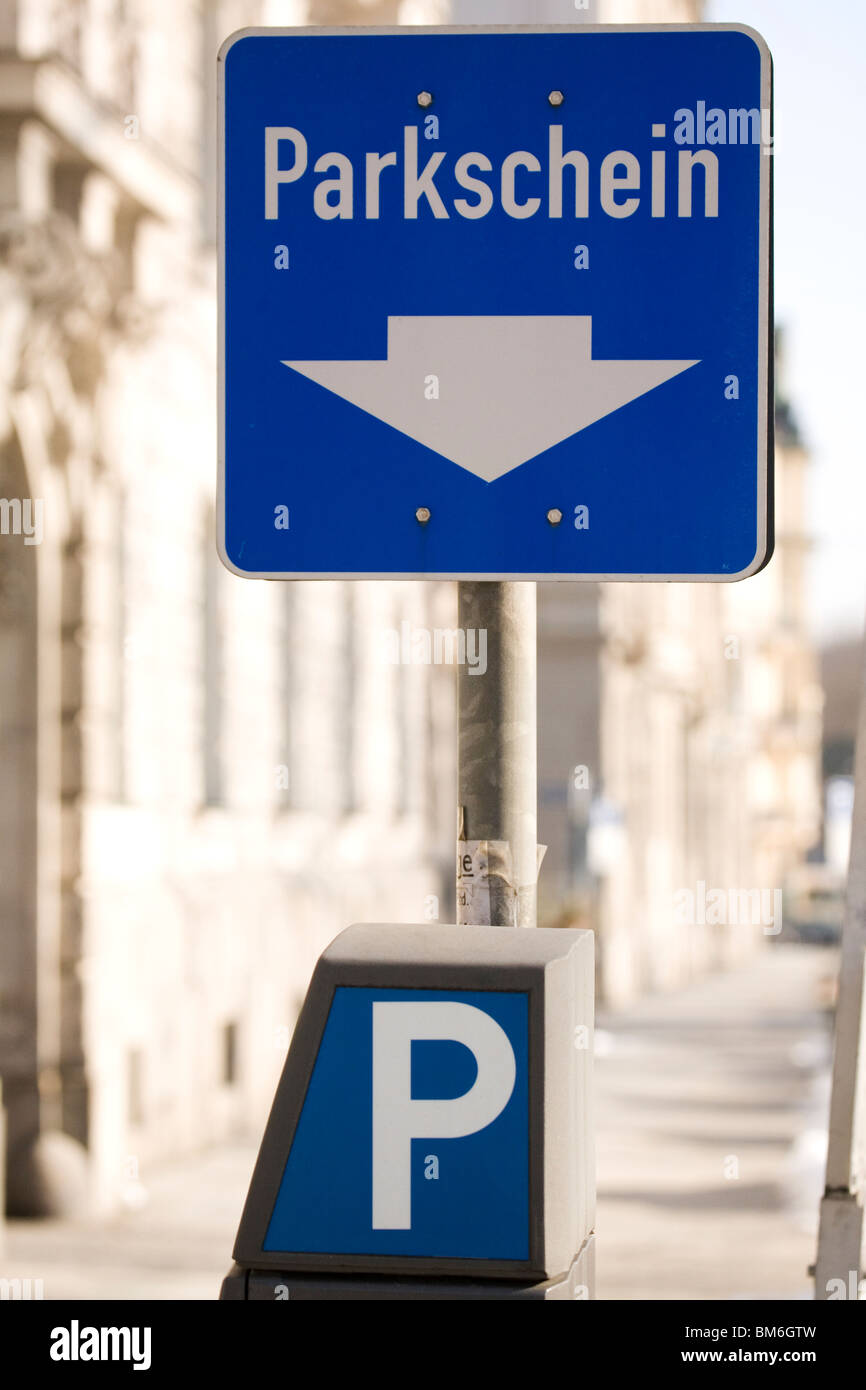 A German sign points people to where they can purchase parking tickets ...