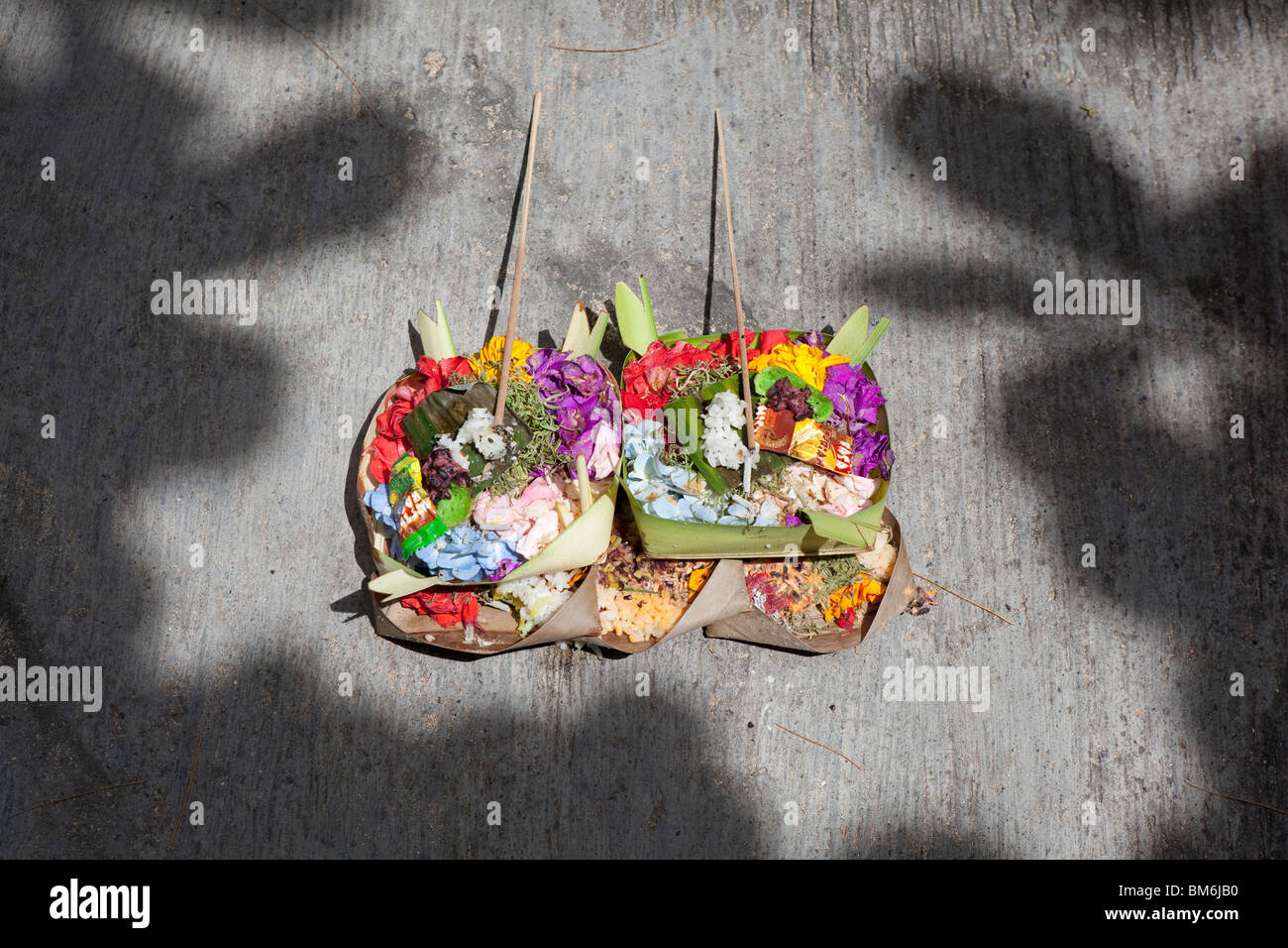 Offerboxes with flowers,food and incense, Bali, Indonesia Stock Photo ...