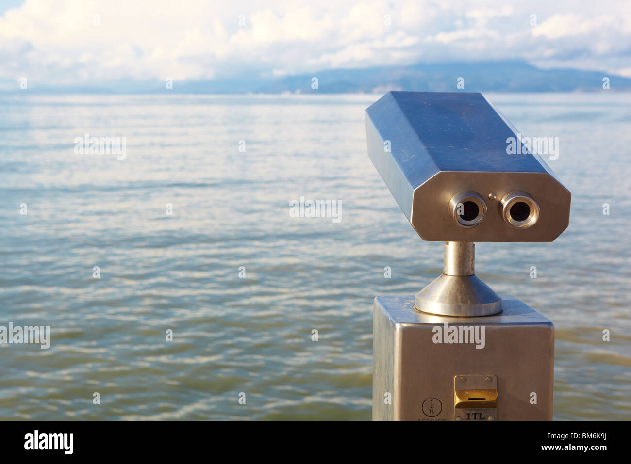 A metallic coin operated viewer for tourists to look at the Greek ...